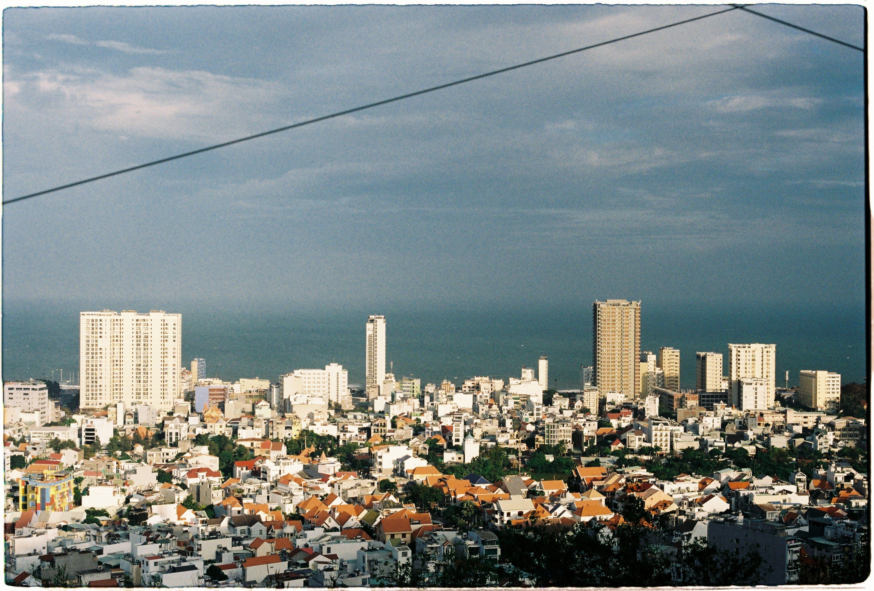 Aerial View of Coastal Cityscape with Ocean · Free Stock Photo