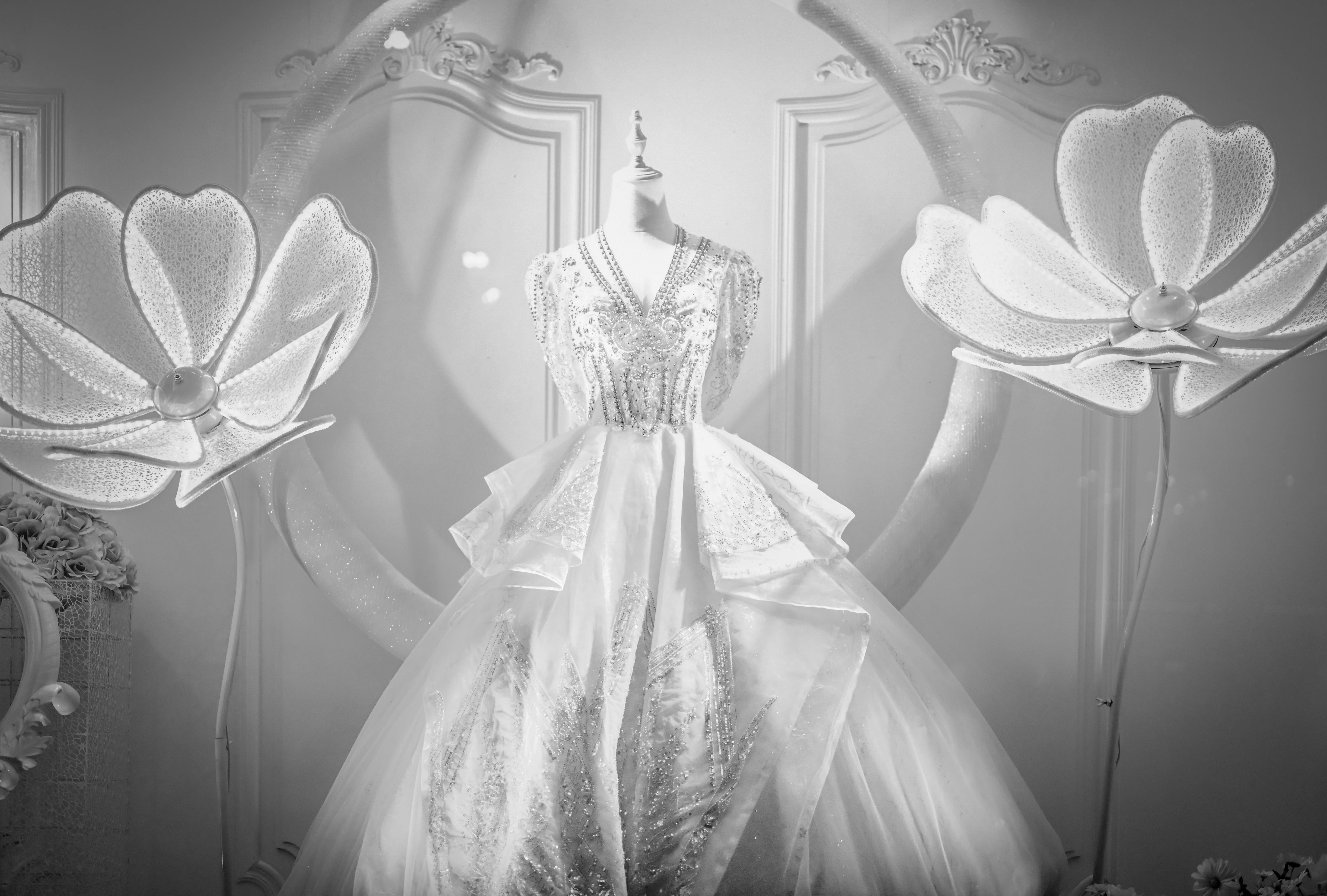 Elegant Wedding Dress Display with Floral Decor · Free Stock Photo