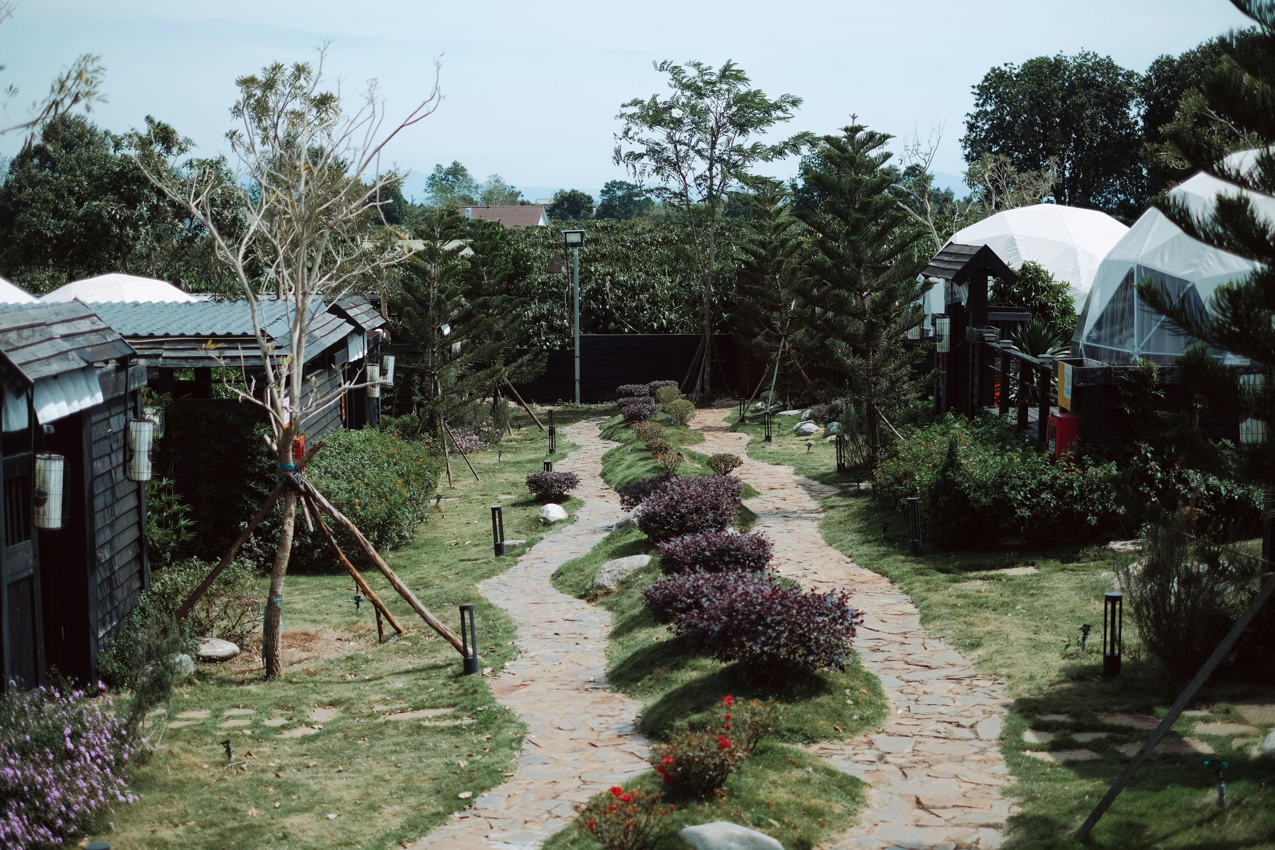 Scenic rustic garden pathway with domes · Free Stock Photo