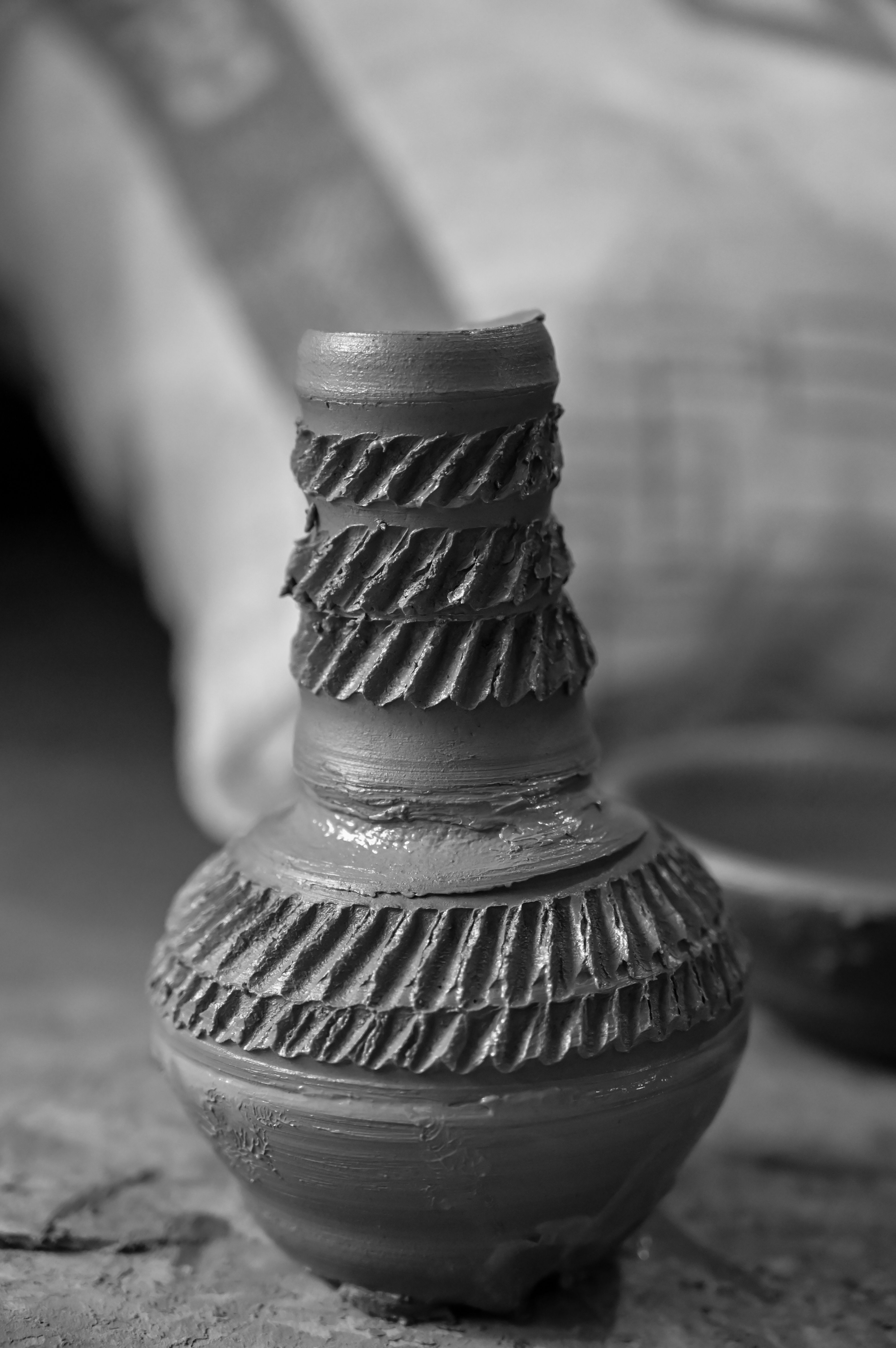 Intricate Clay Vase with Textured Design · Free Stock Photo