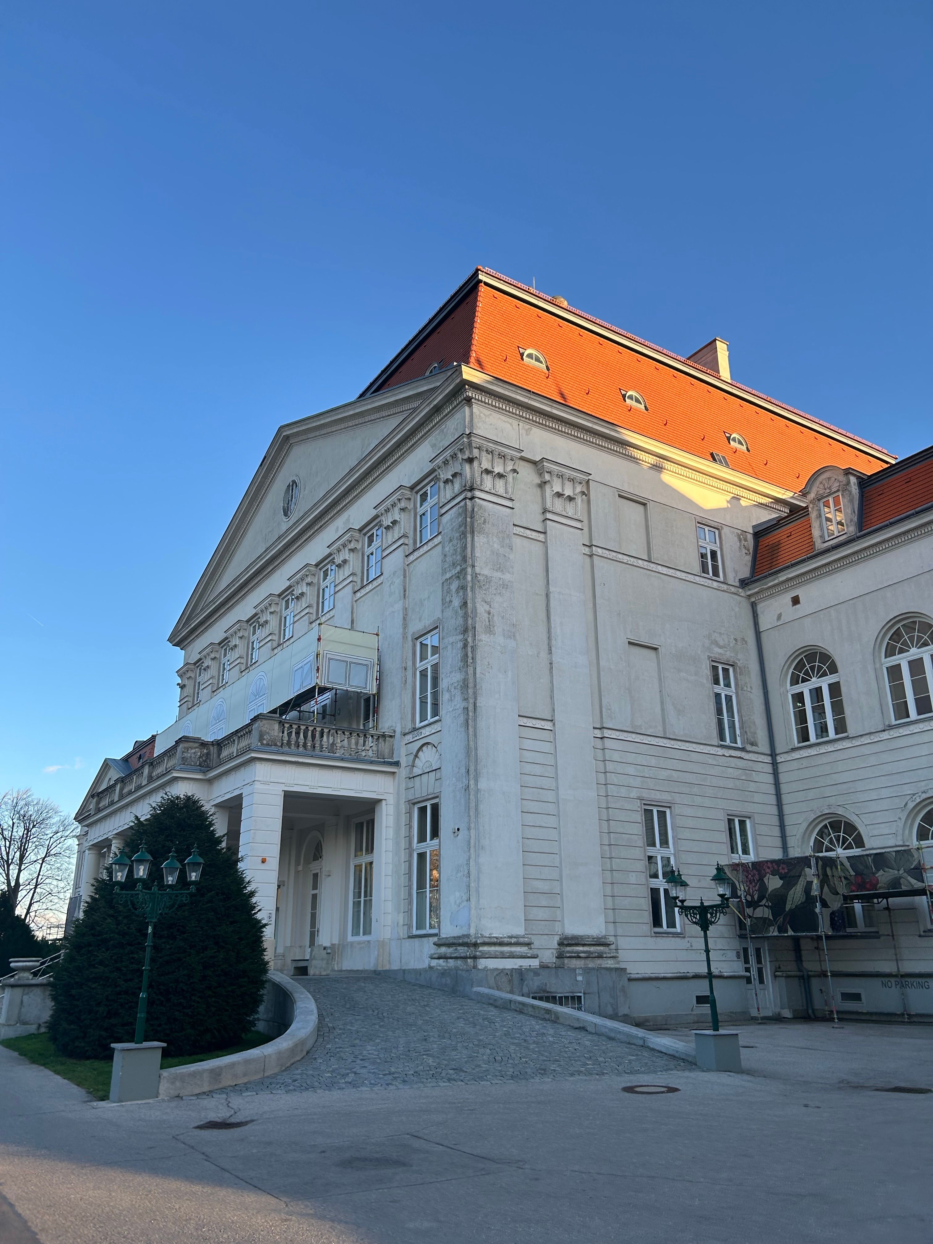 Grand Neoclassical Building Against Blue Sky · Free Stock Photo
