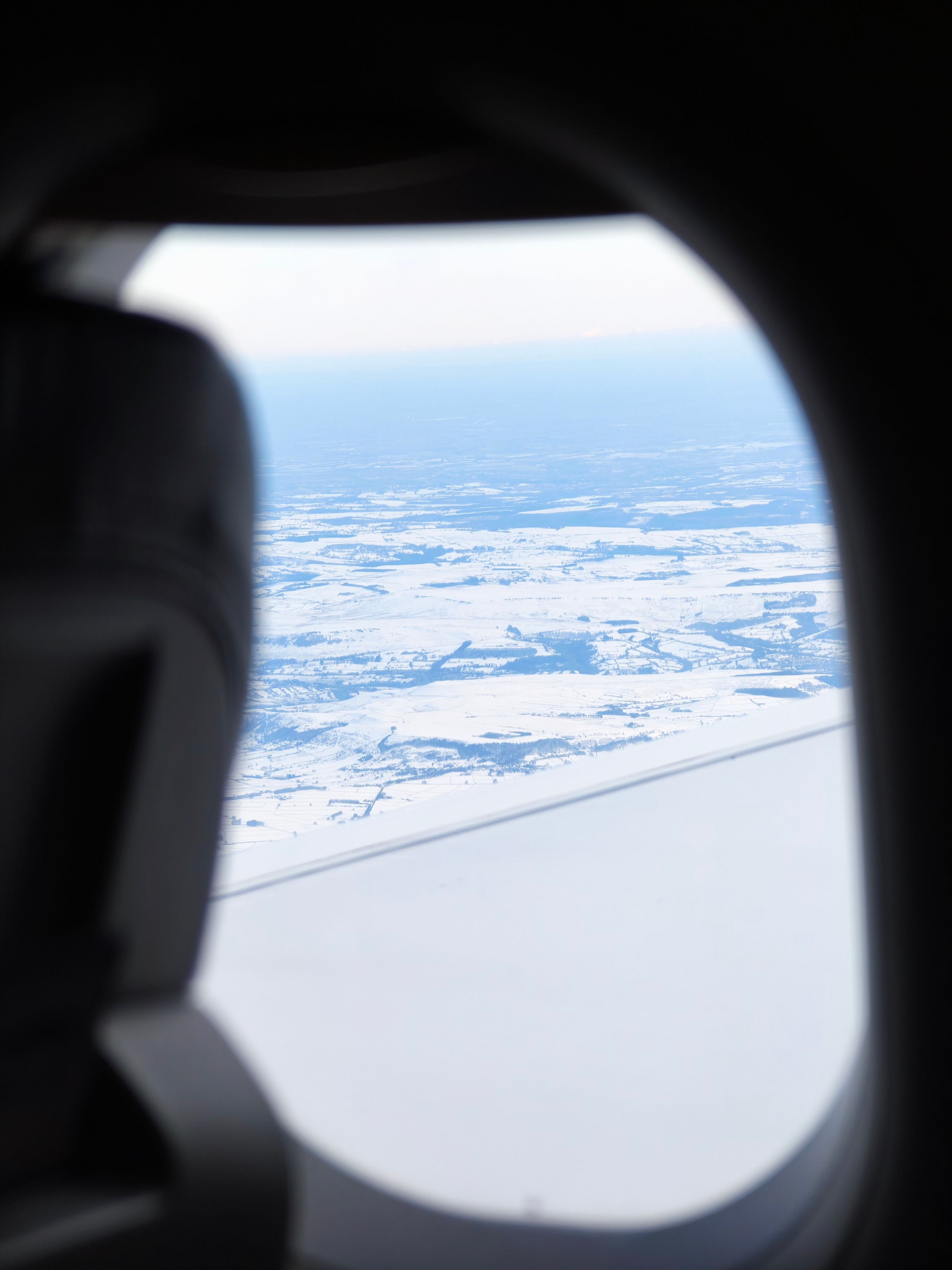 Scenic Aerial View of Snowy Landscape from Airplane · Free Stock Photo