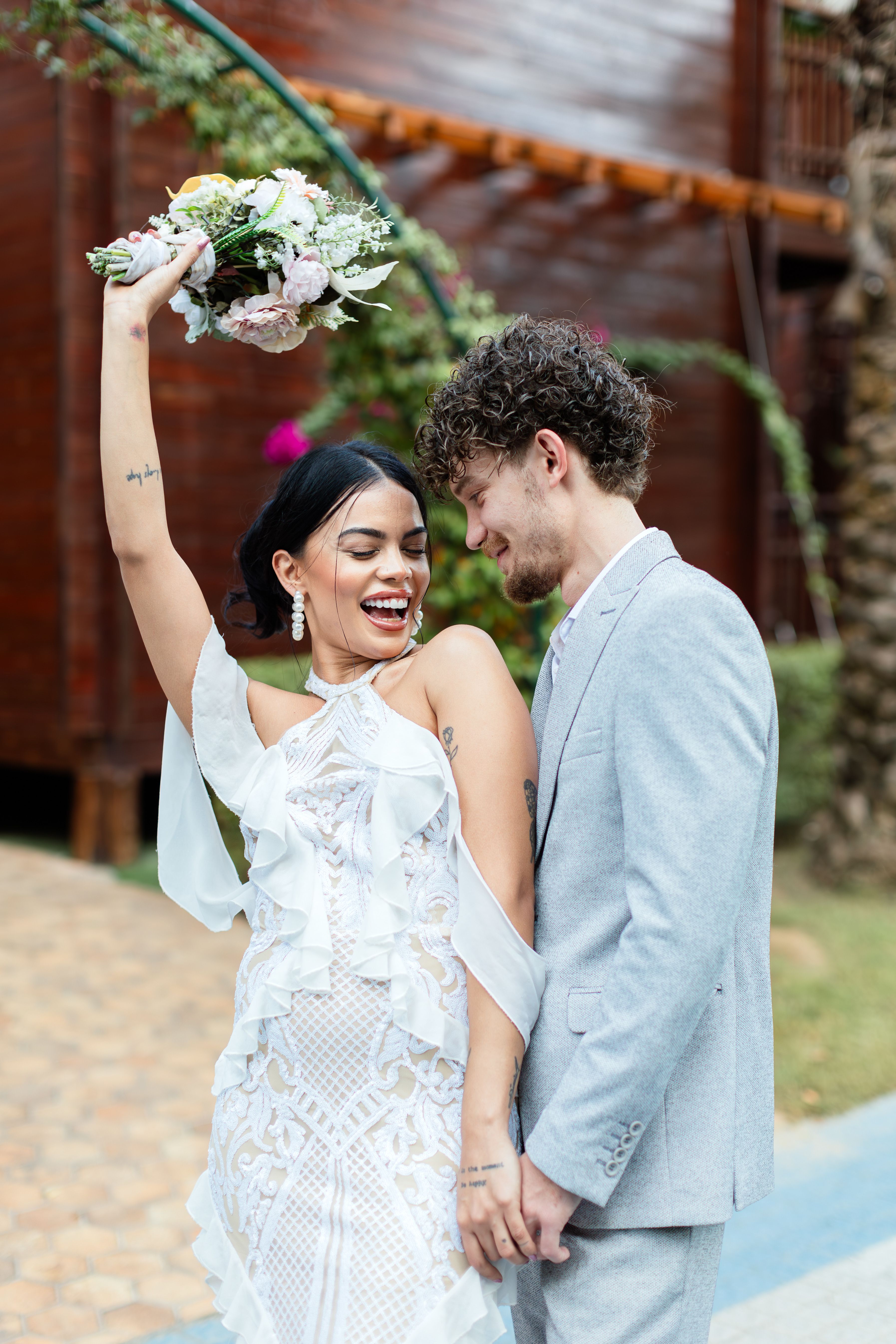 Joyful Bride and Groom Celebrating Outdoors · Free Stock Photo
