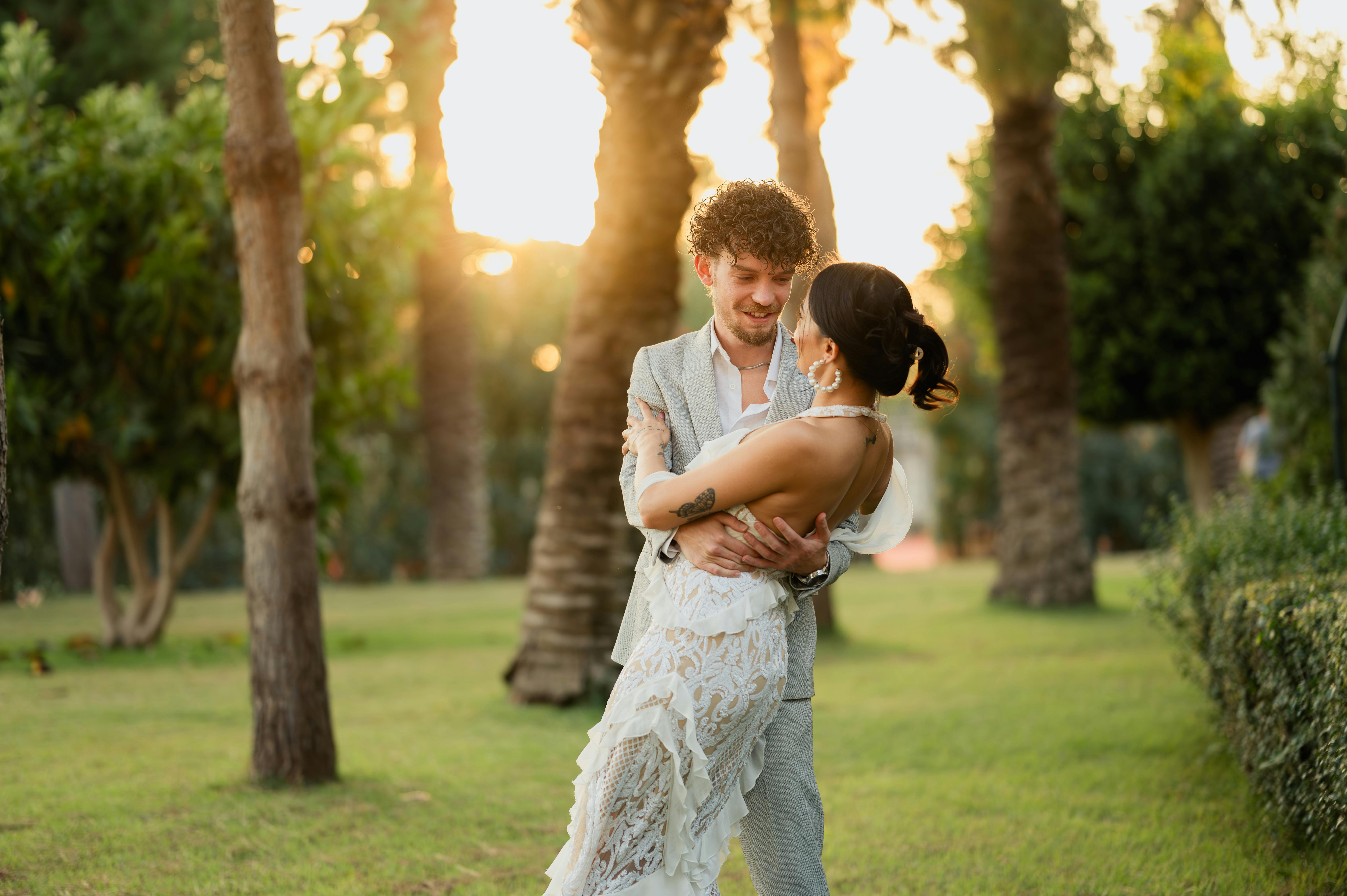 Romantic Wedding Couple Dancing in Garden · Free Stock Photo