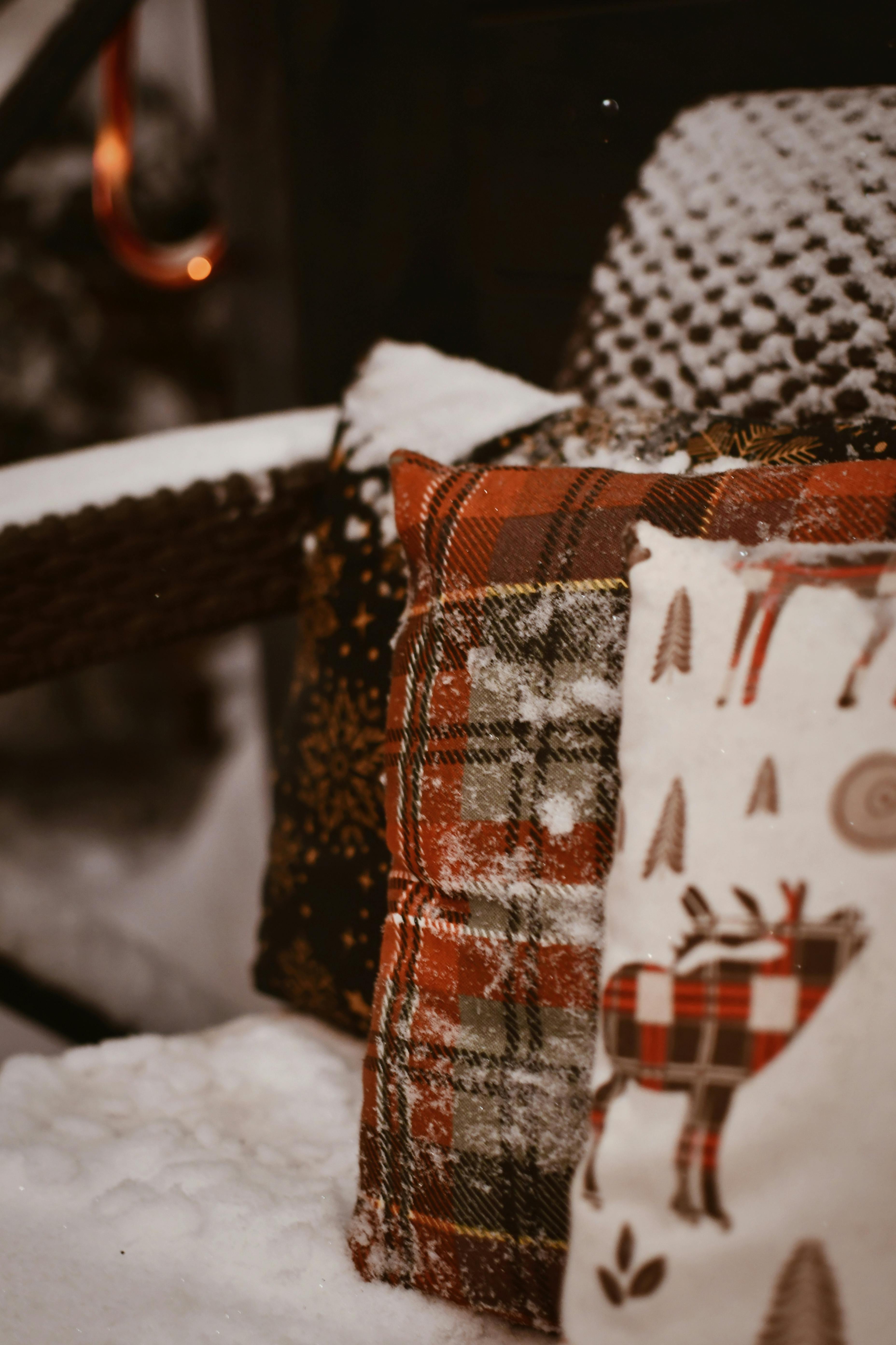 Cozy winter setting with patterned cushions · Free Stock Photo
