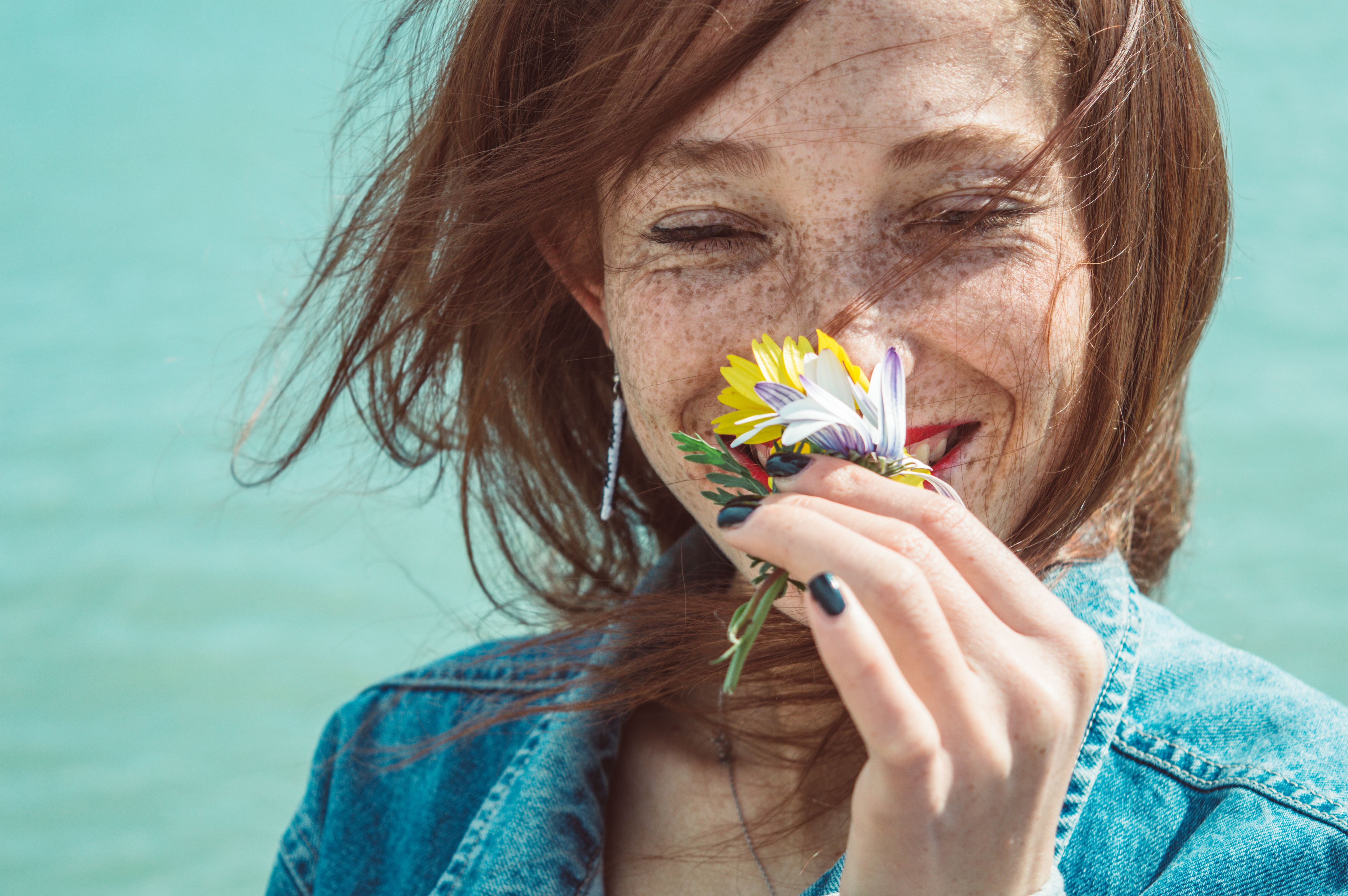 Photo of Woman Smelling Flower · Free Stock Photo