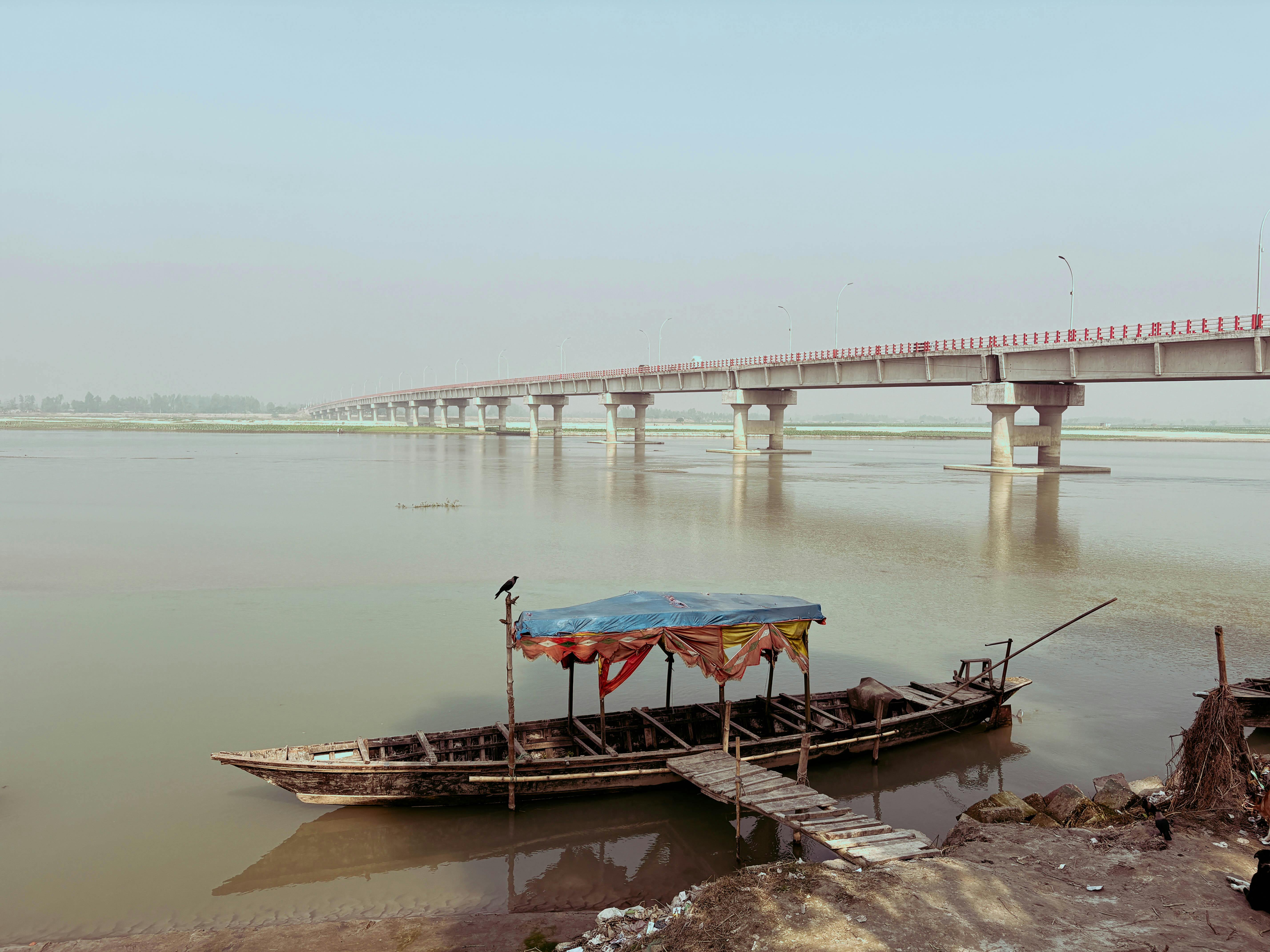 Traditional Boat and Bridge in Tetulia, Bangladesh · Free Stock Photo