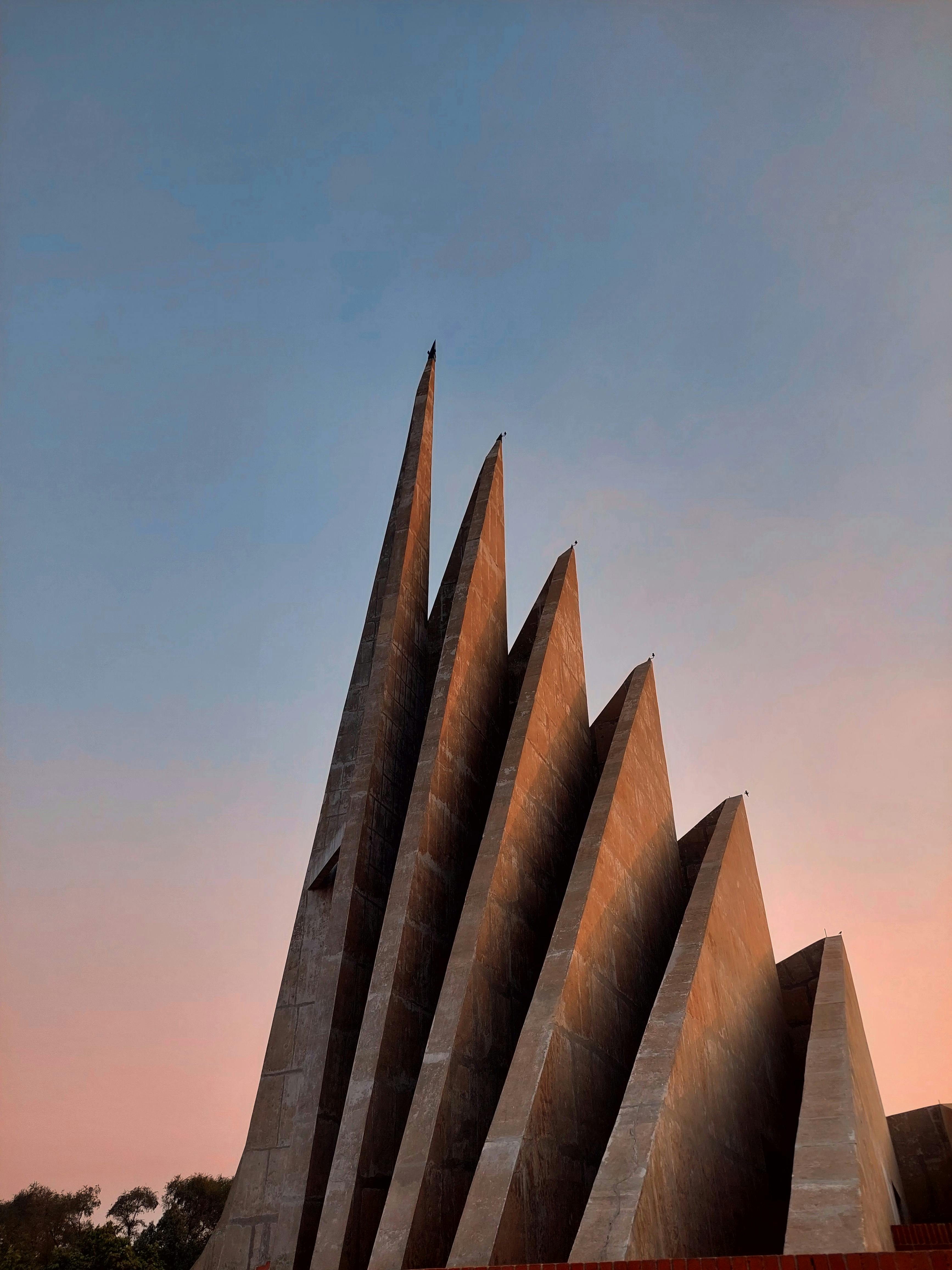 Dramatic Architecture Against Sunset Sky · Free Stock Photo