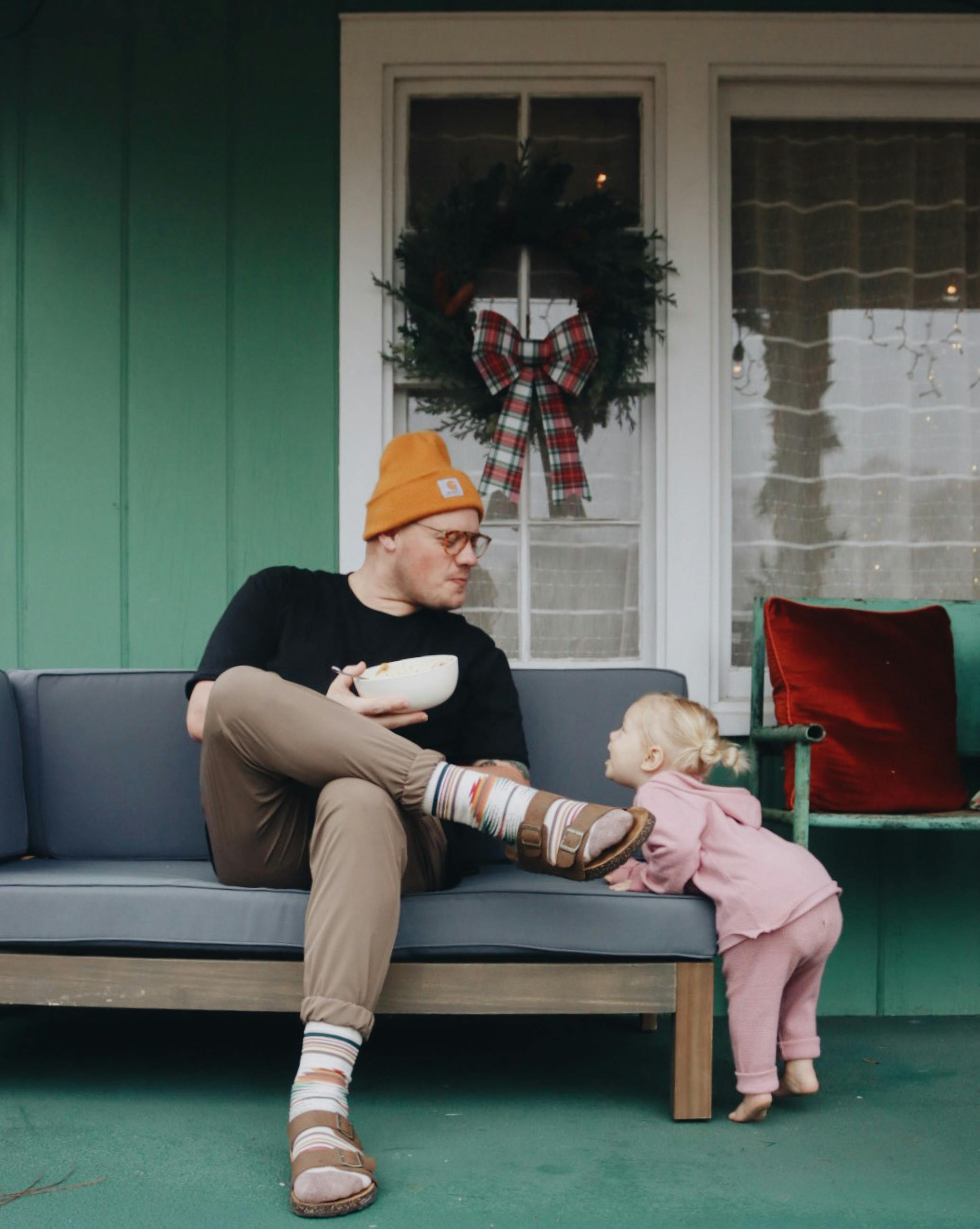 Father and Daughter Sharing a Cozy Holiday Moment · Free Stock Photo