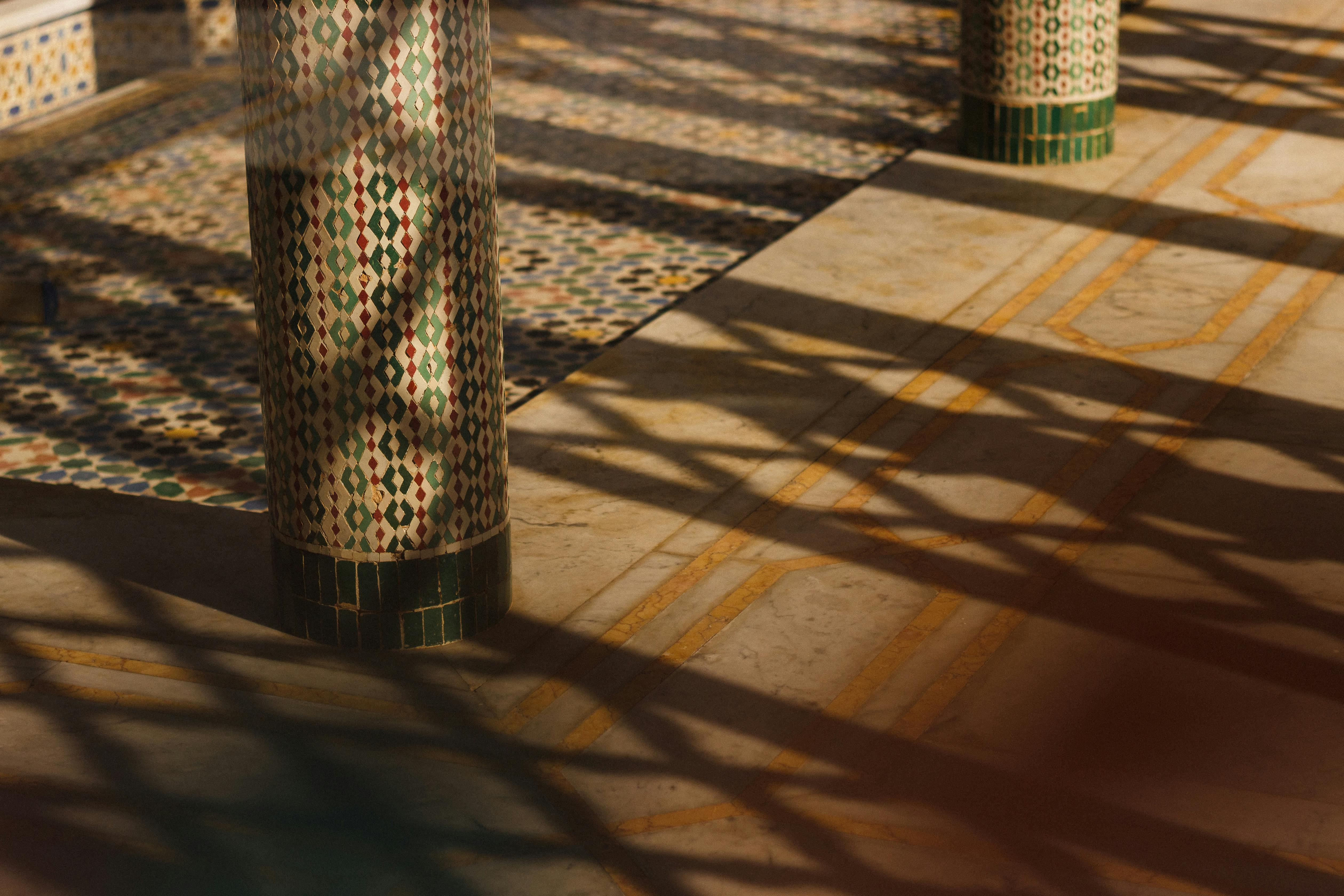 Sunlit Moroccan Mosaic Columns and Shadows · Free Stock Photo