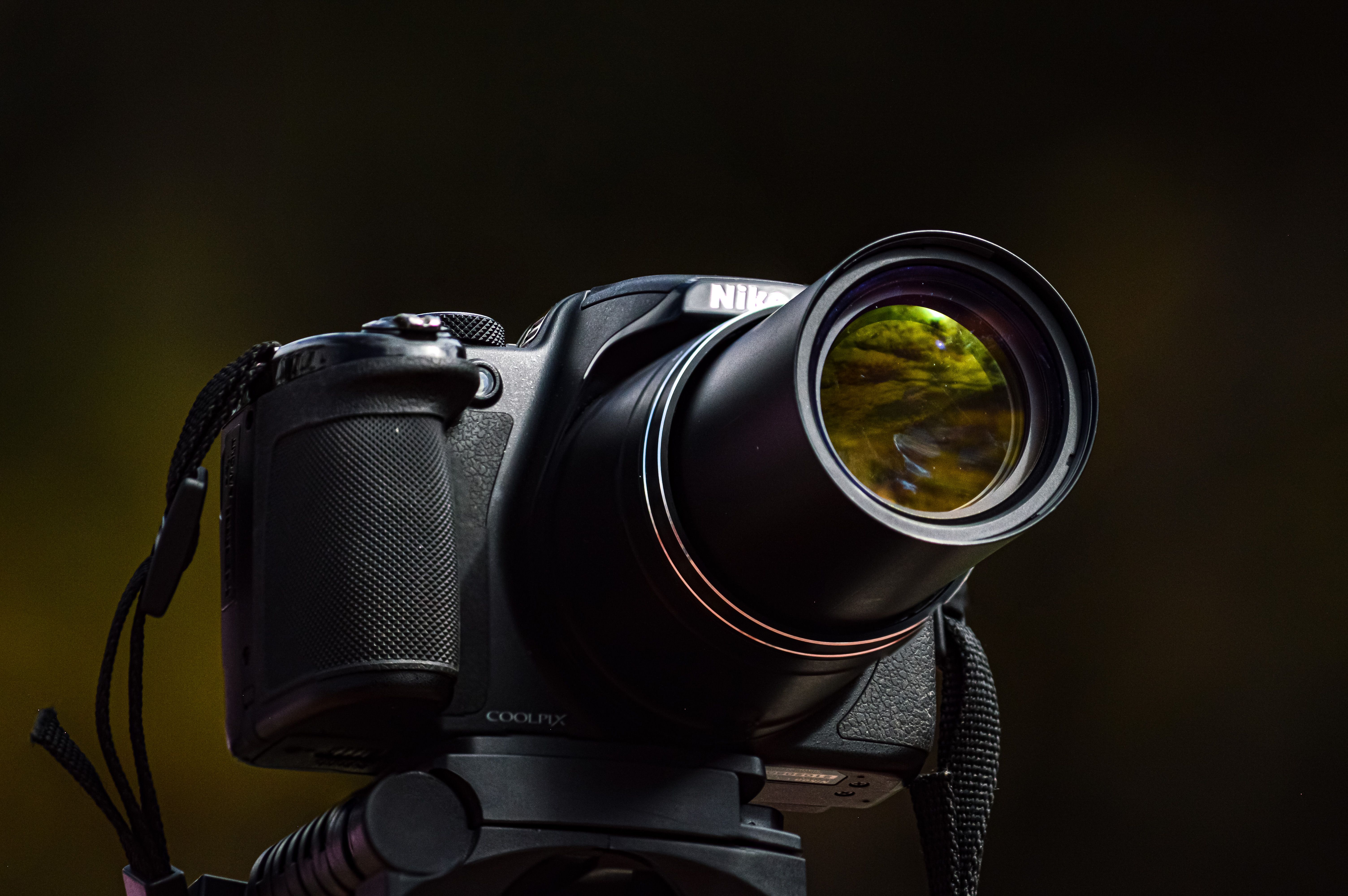 Close-up of Camera with Telephoto Lens Outdoors · Free Stock Photo