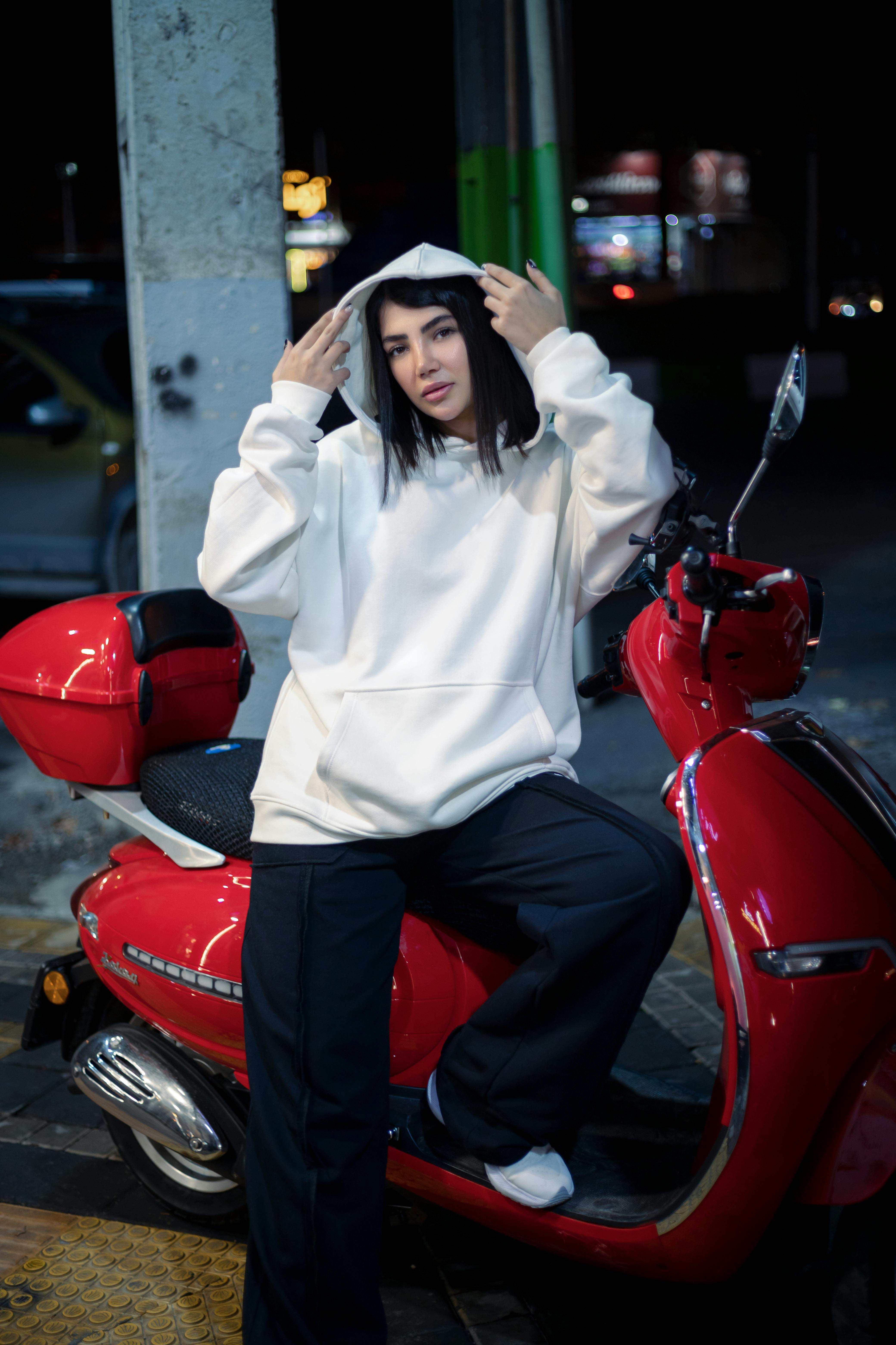 Young Woman on Red Scooter at Night Urban Scene · Free Stock Photo