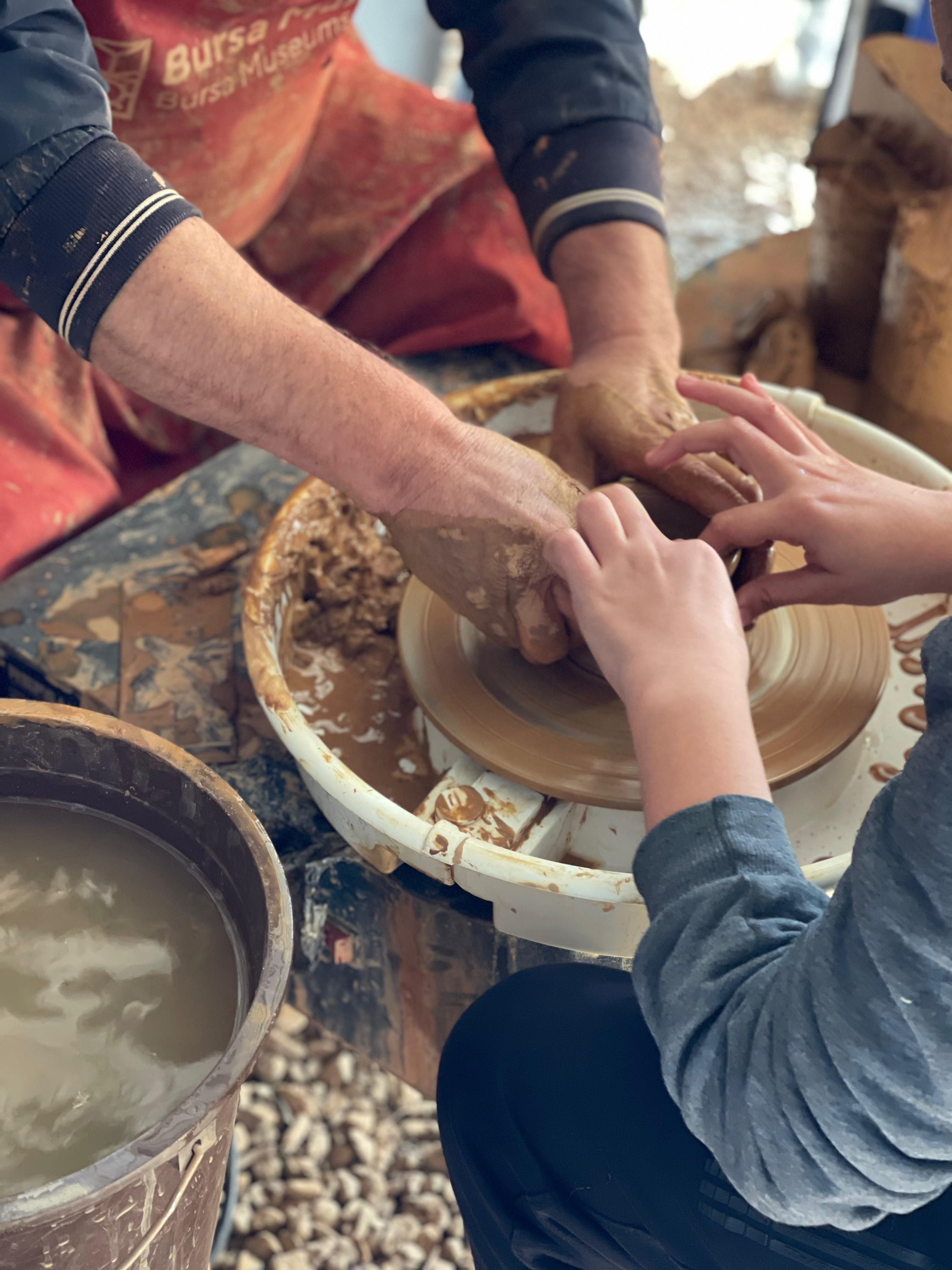 Pottery Lesson with Clay on Spinning Wheel · Free Stock Photo