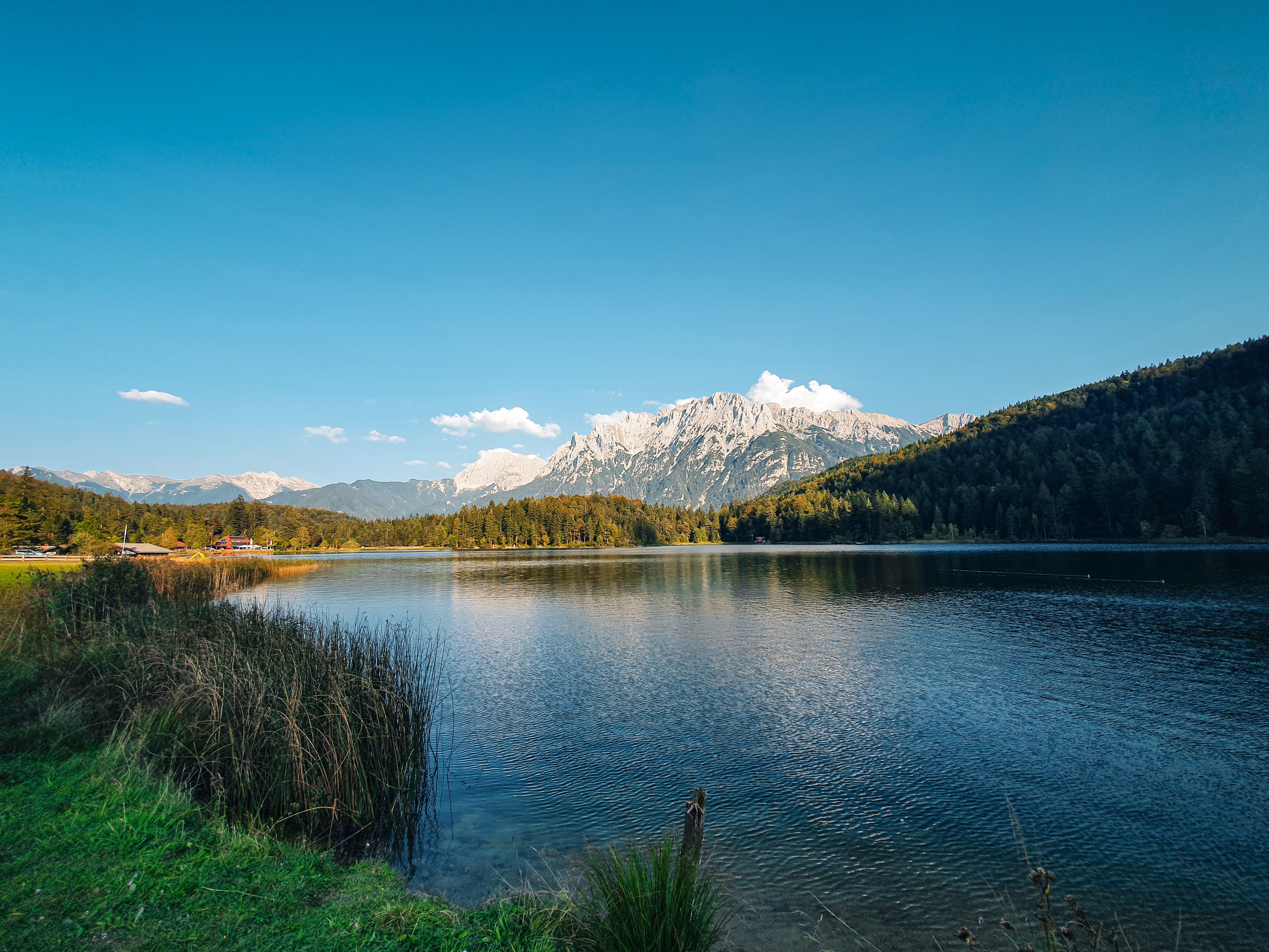 Serene Lake in Mittenwald with Mountain View · Free Stock Photo