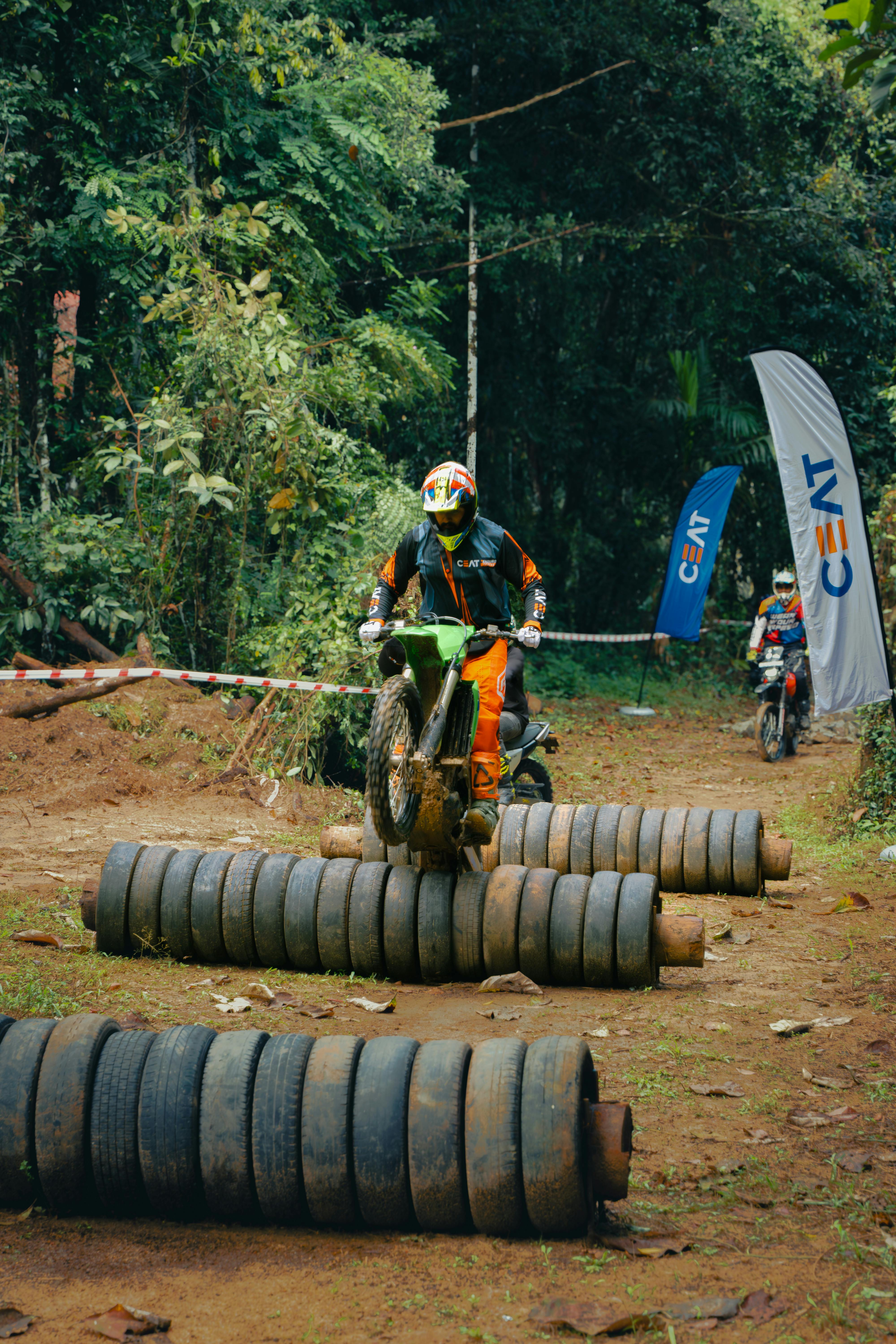 Exciting Off-road Motorcycle Racing in Forest · Free Stock Photo