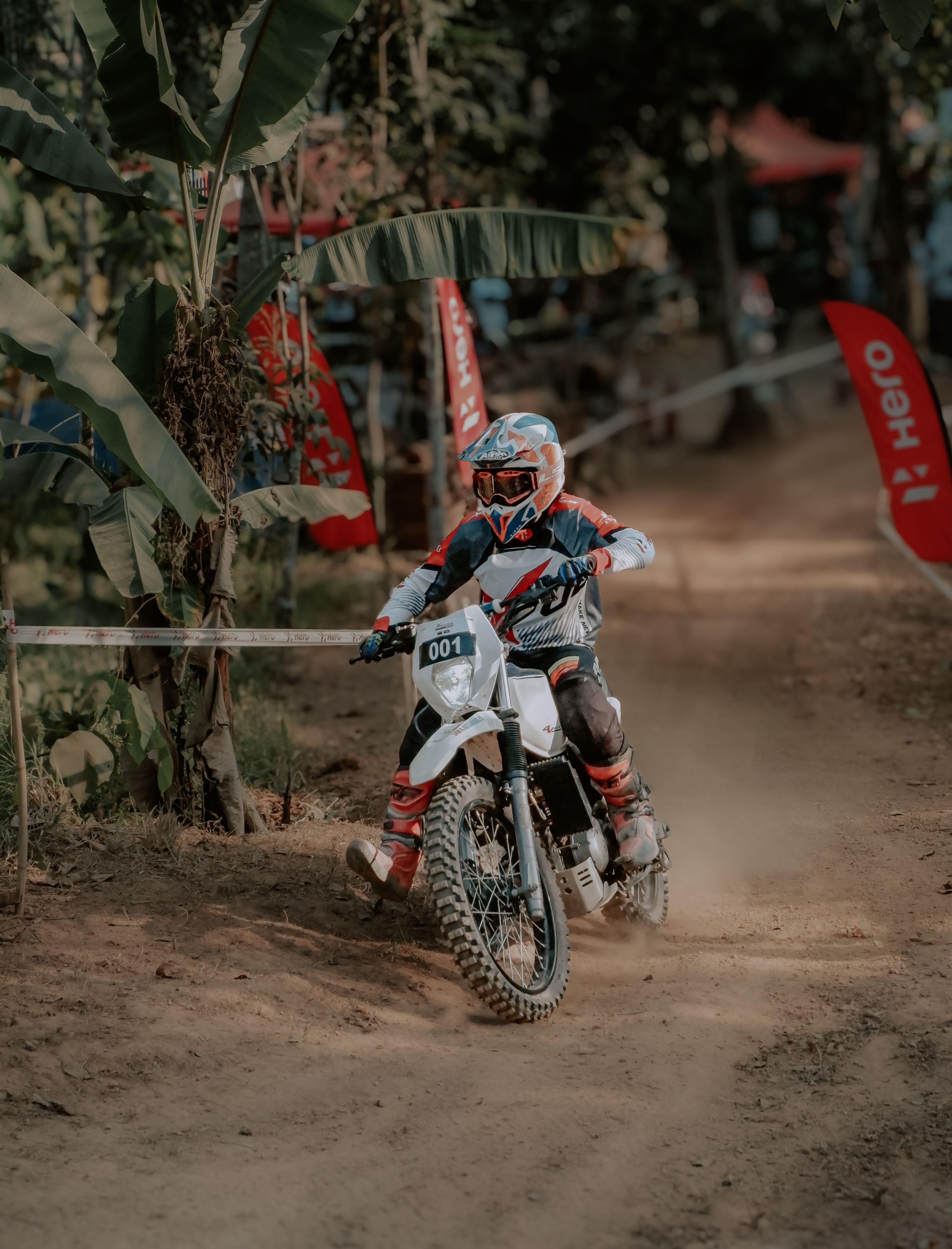 Exciting Off-road Motorcycle Race in Forest Path · Free Stock Photo
