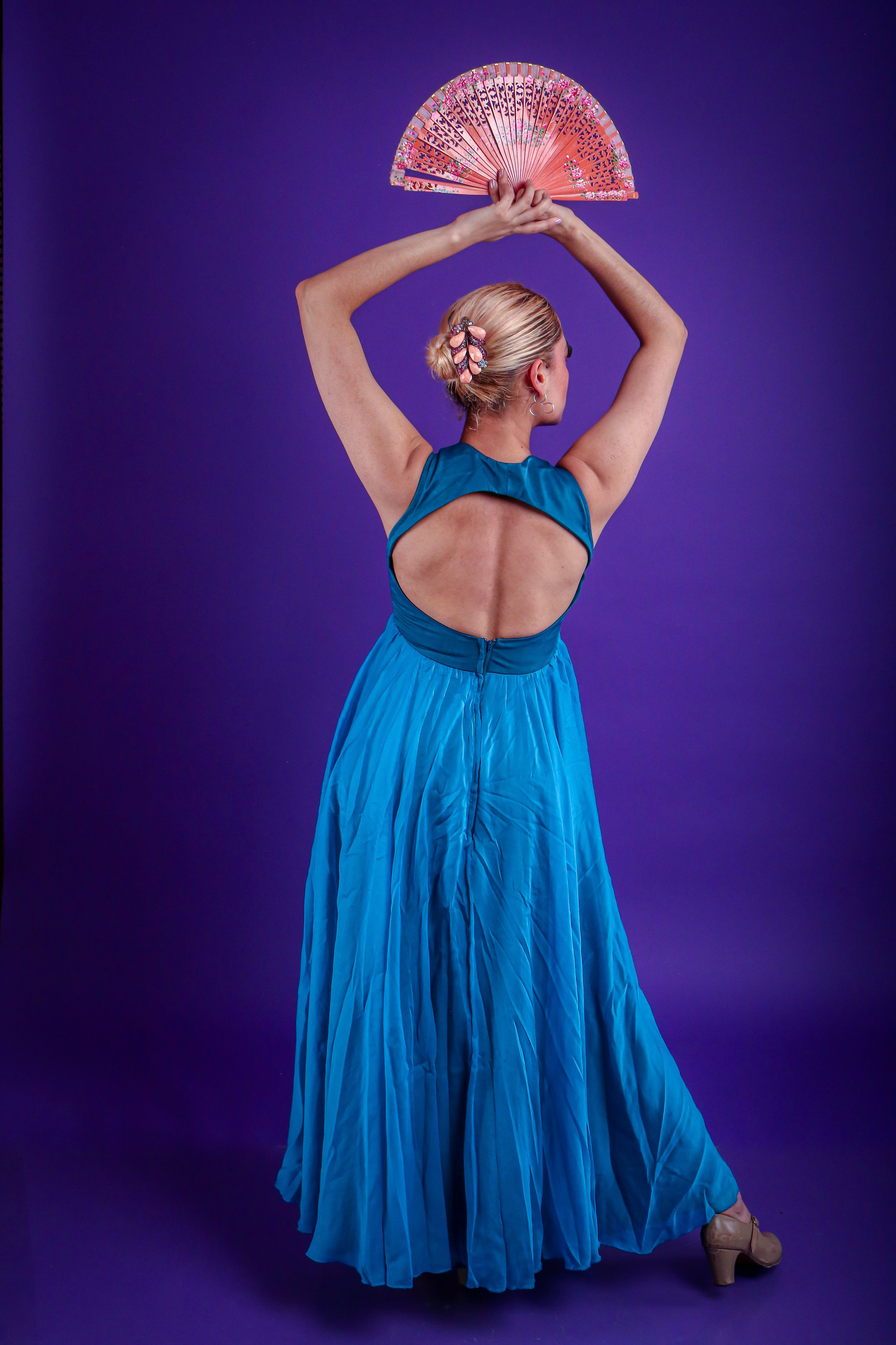 Graceful dancer with fan in vibrant blue dress · Free Stock Photo