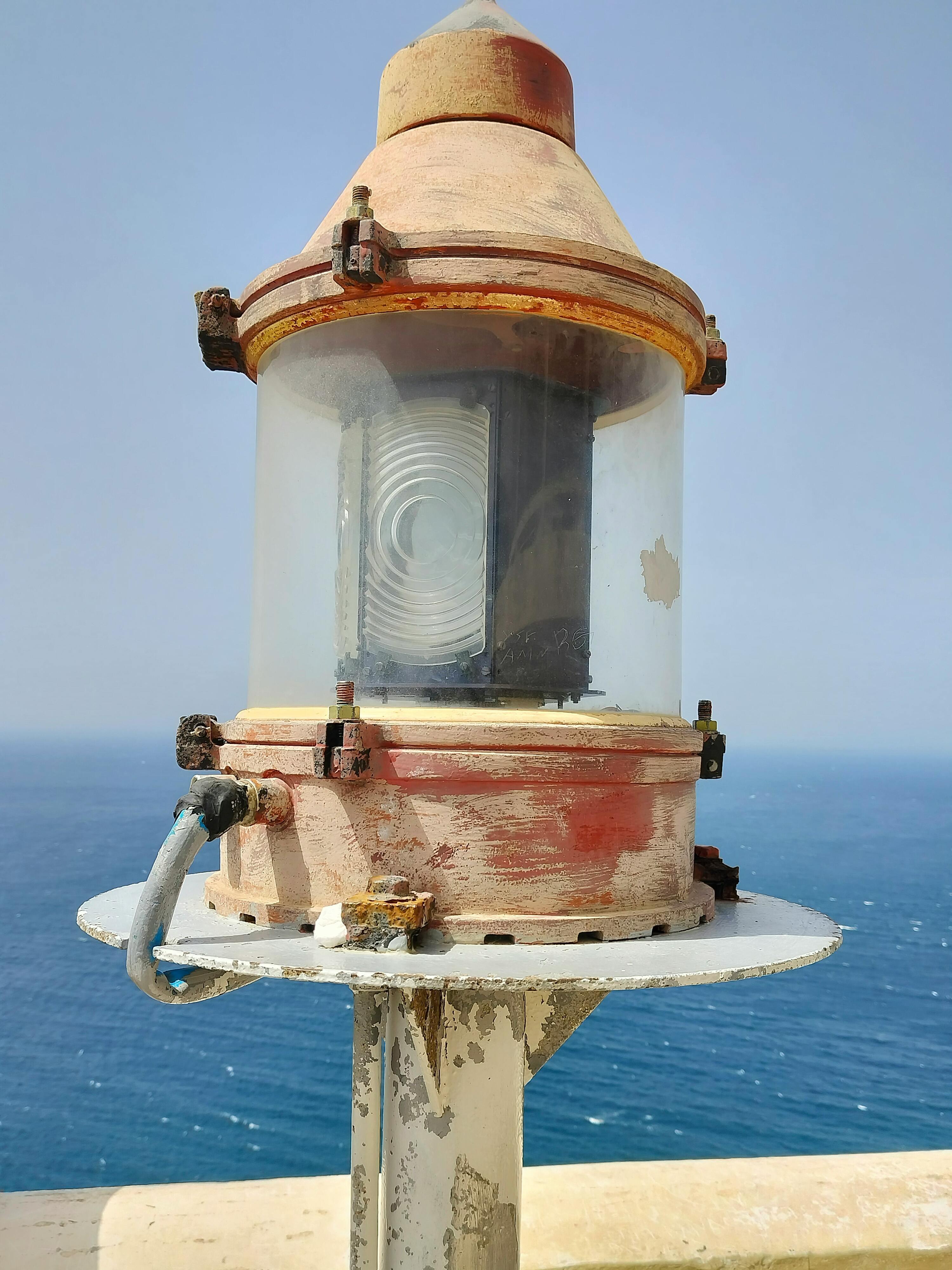 Rustic Lighthouse Lamp by the Sea · Free Stock Photo