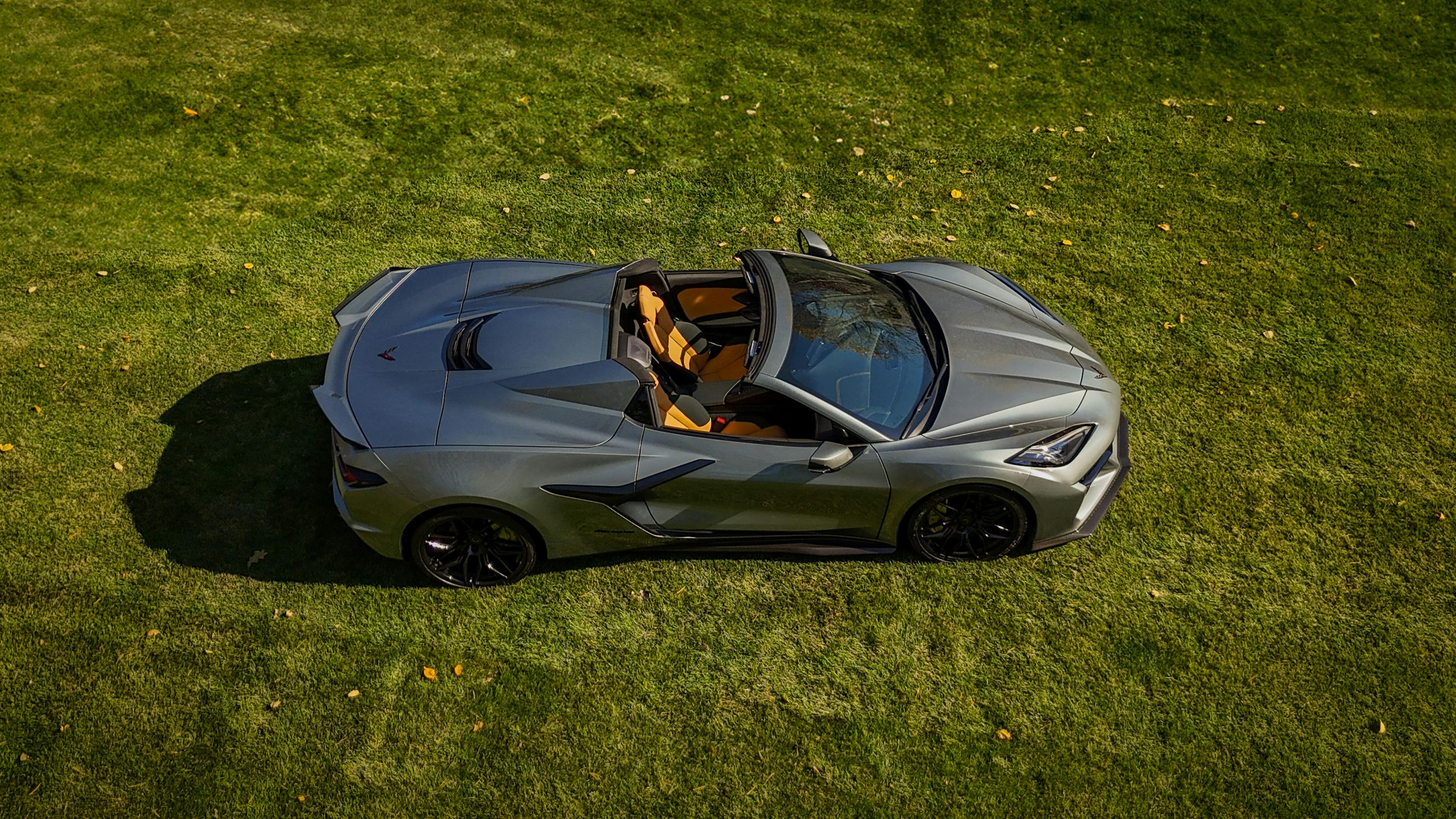 Sleek Silver Convertible Car on Green Grass · Free Stock Photo