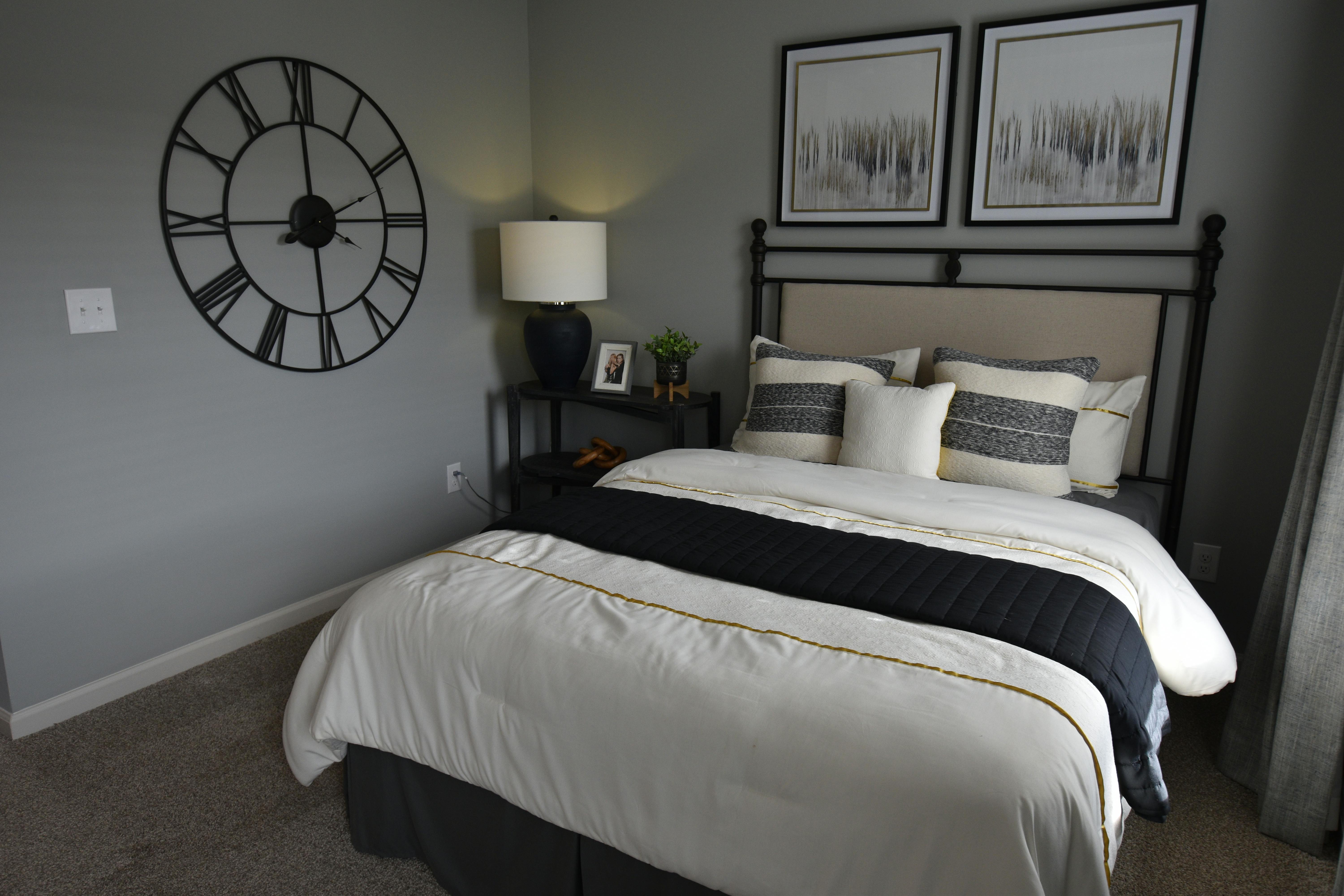 Contemporary Bedroom with Wall Art and Clock · Free Stock Photo