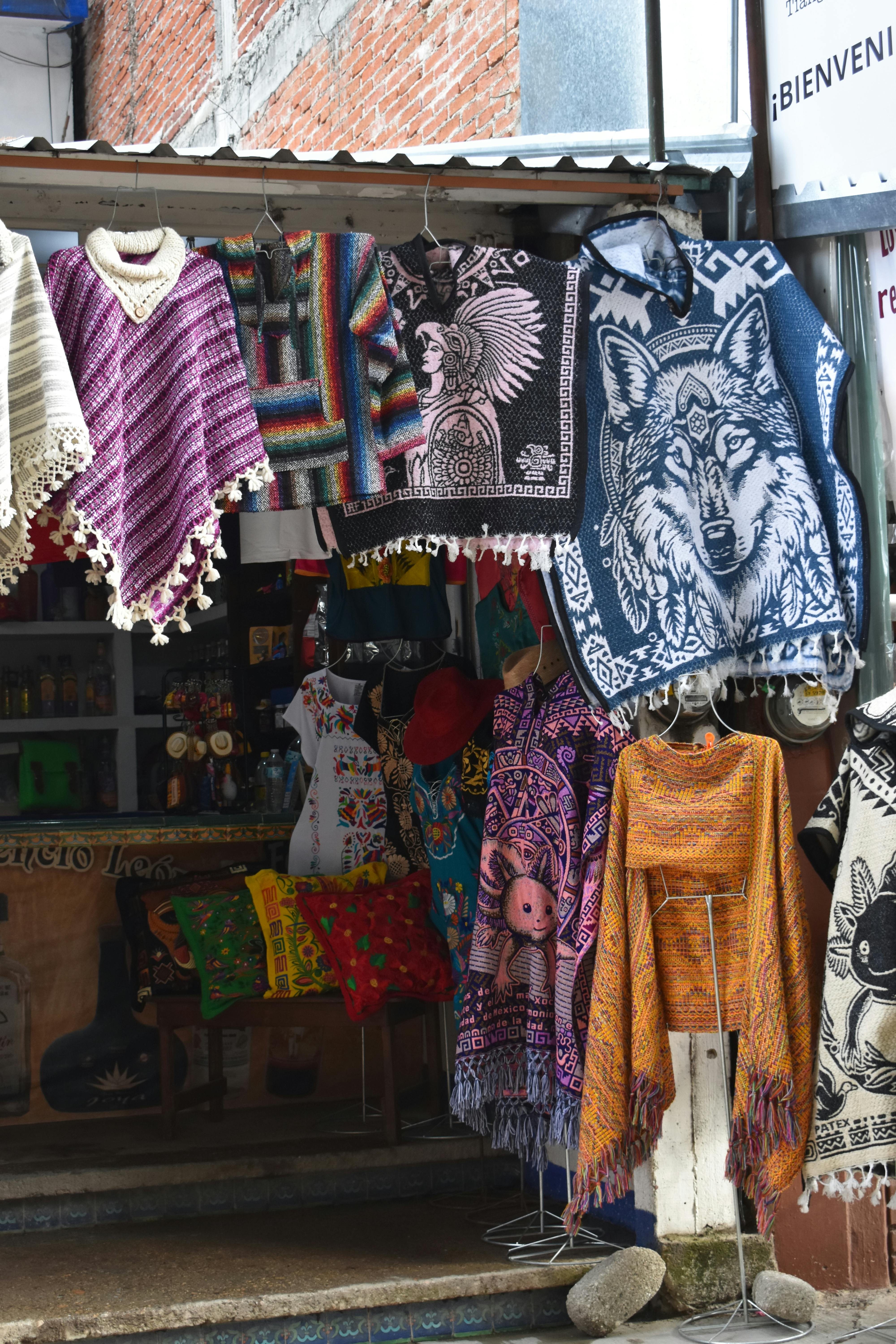 Colorful Ponchos and Textiles on Display at Market · Free Stock Photo