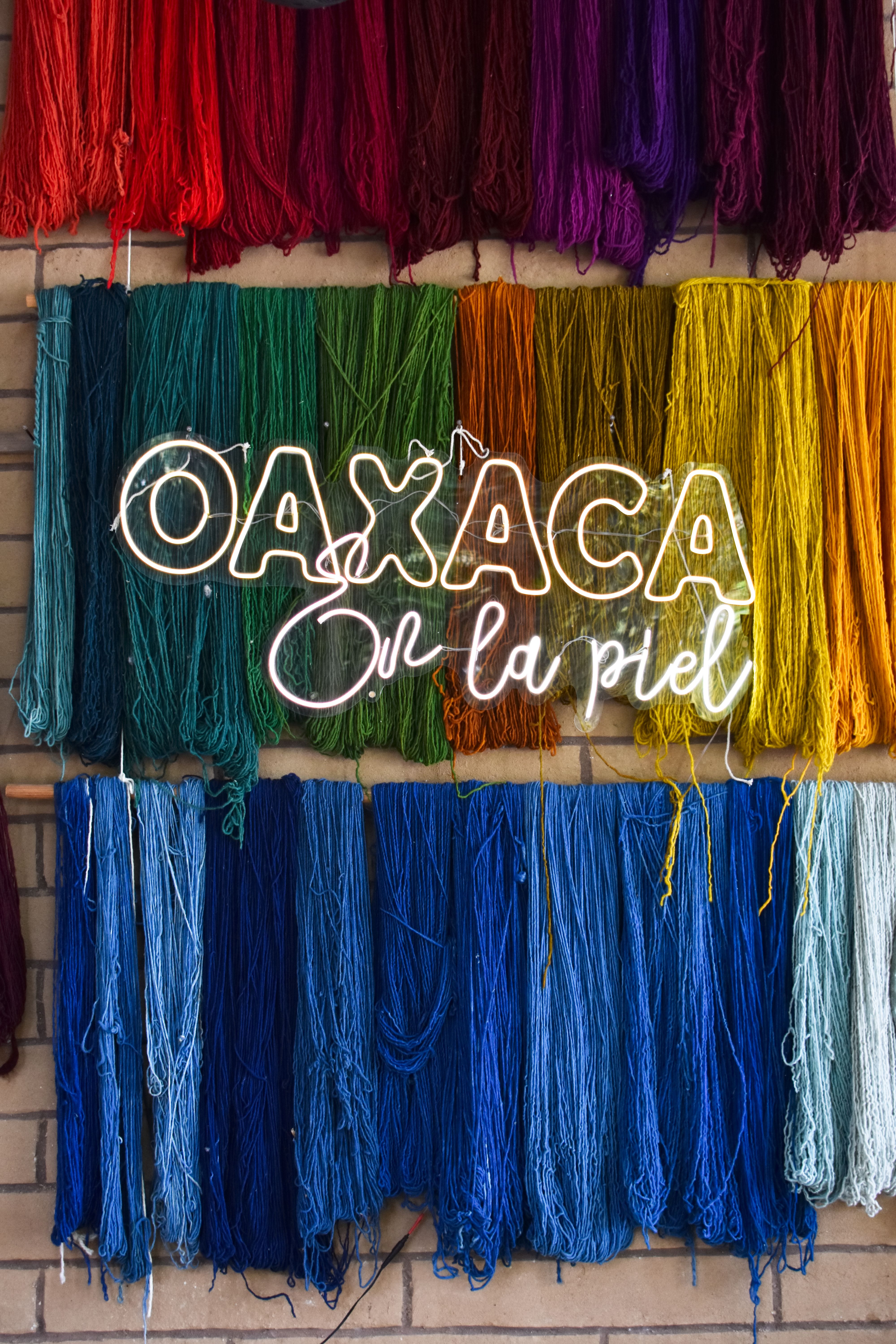 Oaxaca de Juárez Colorful Yarn Display with Signage · Free Stock Photo