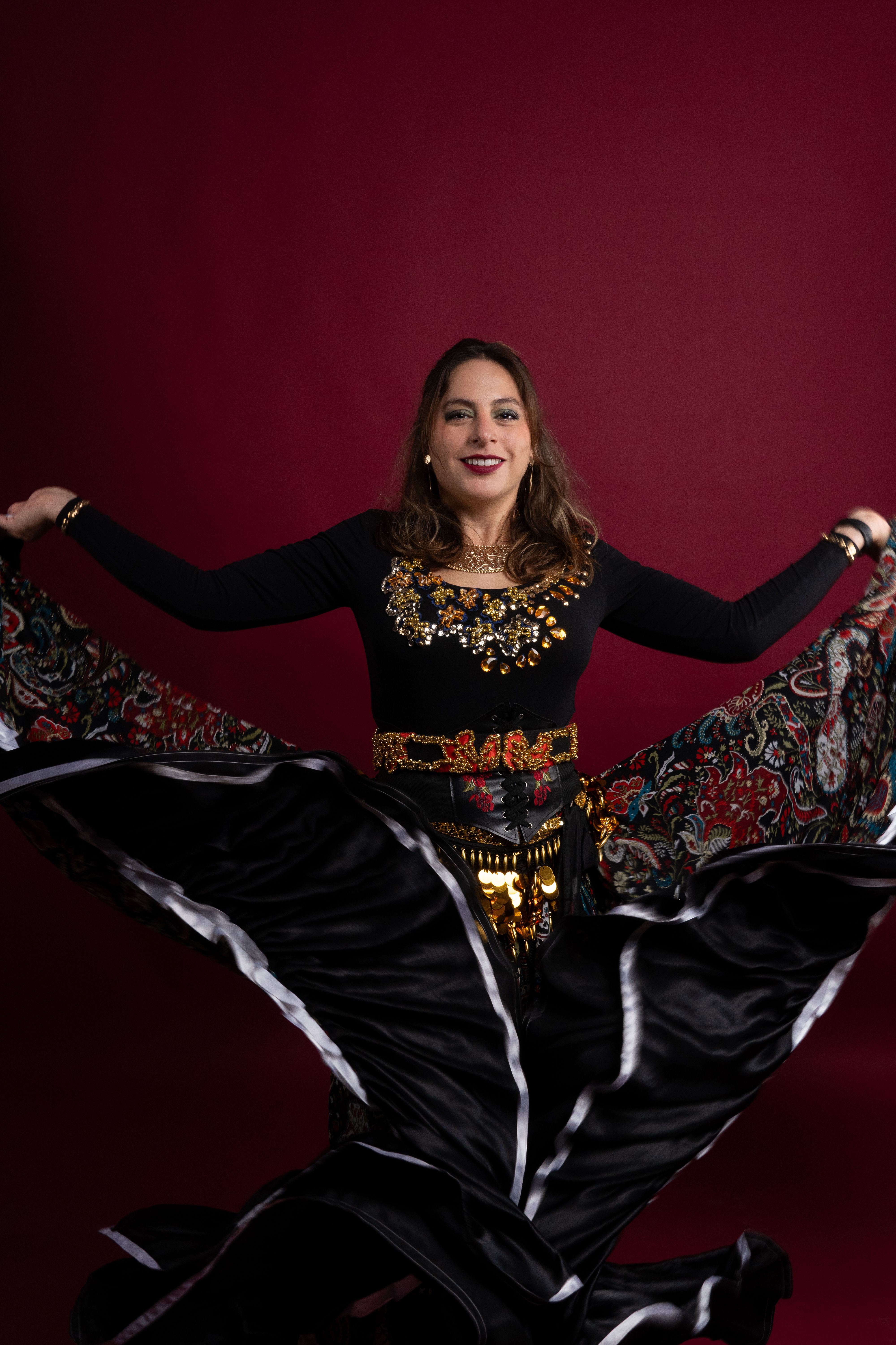 Vibrant Flamenco Dancer with Bold Red Backdrop · Free Stock Photo