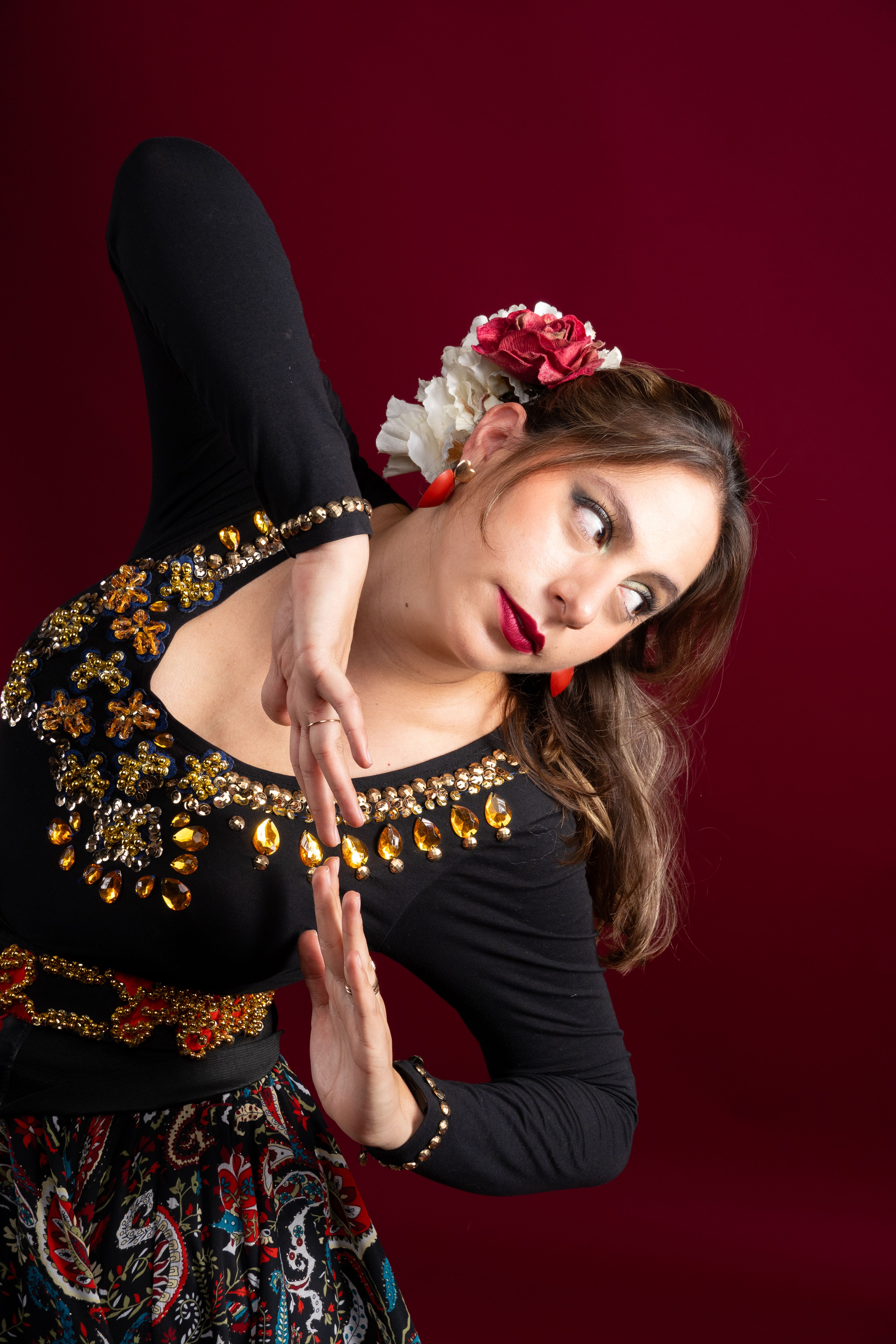 Elegant Female Dancer in Traditional Floral Attire · Free Stock Photo