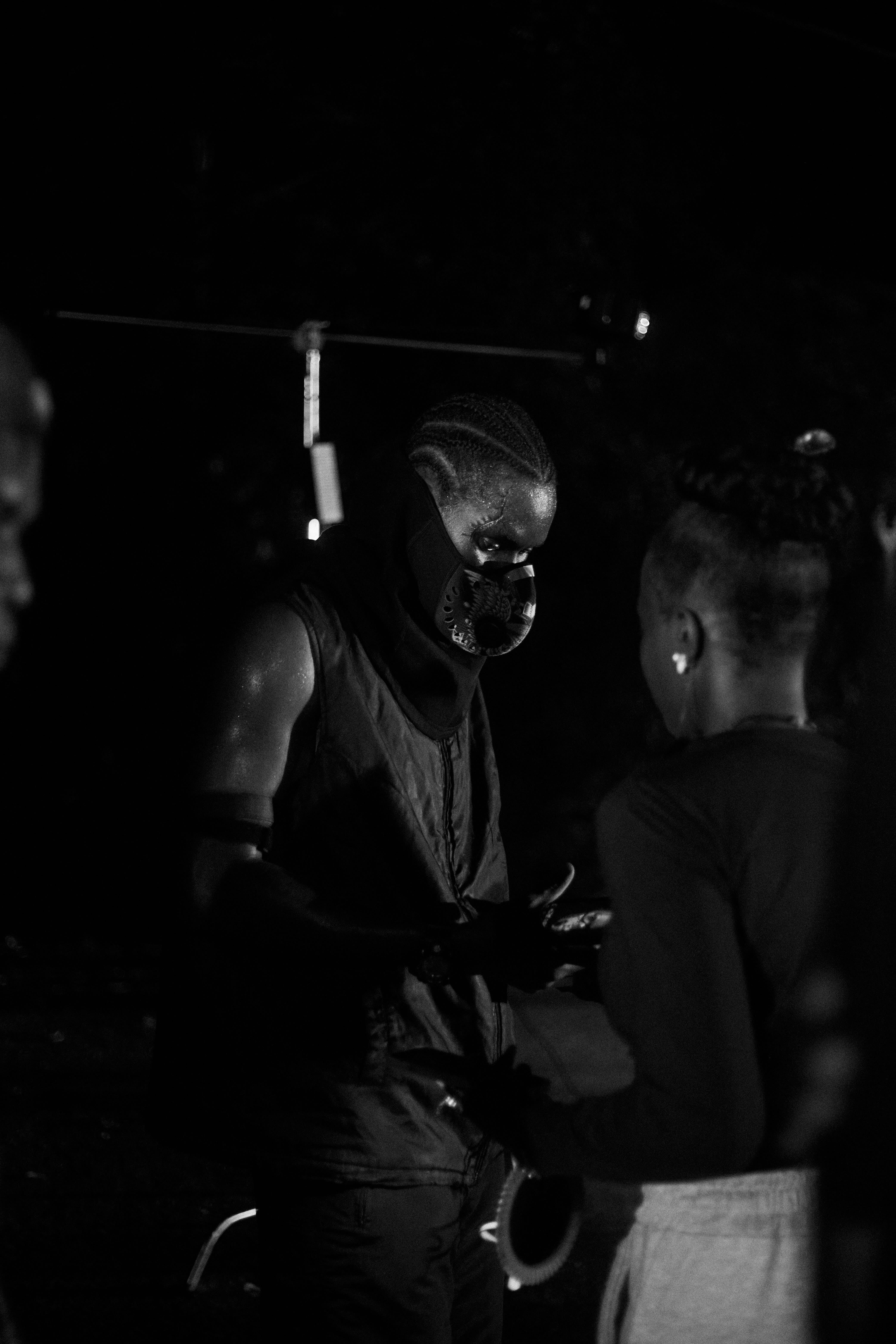 Dramatic Nighttime Encounter with Masked Figure · Free Stock Photo