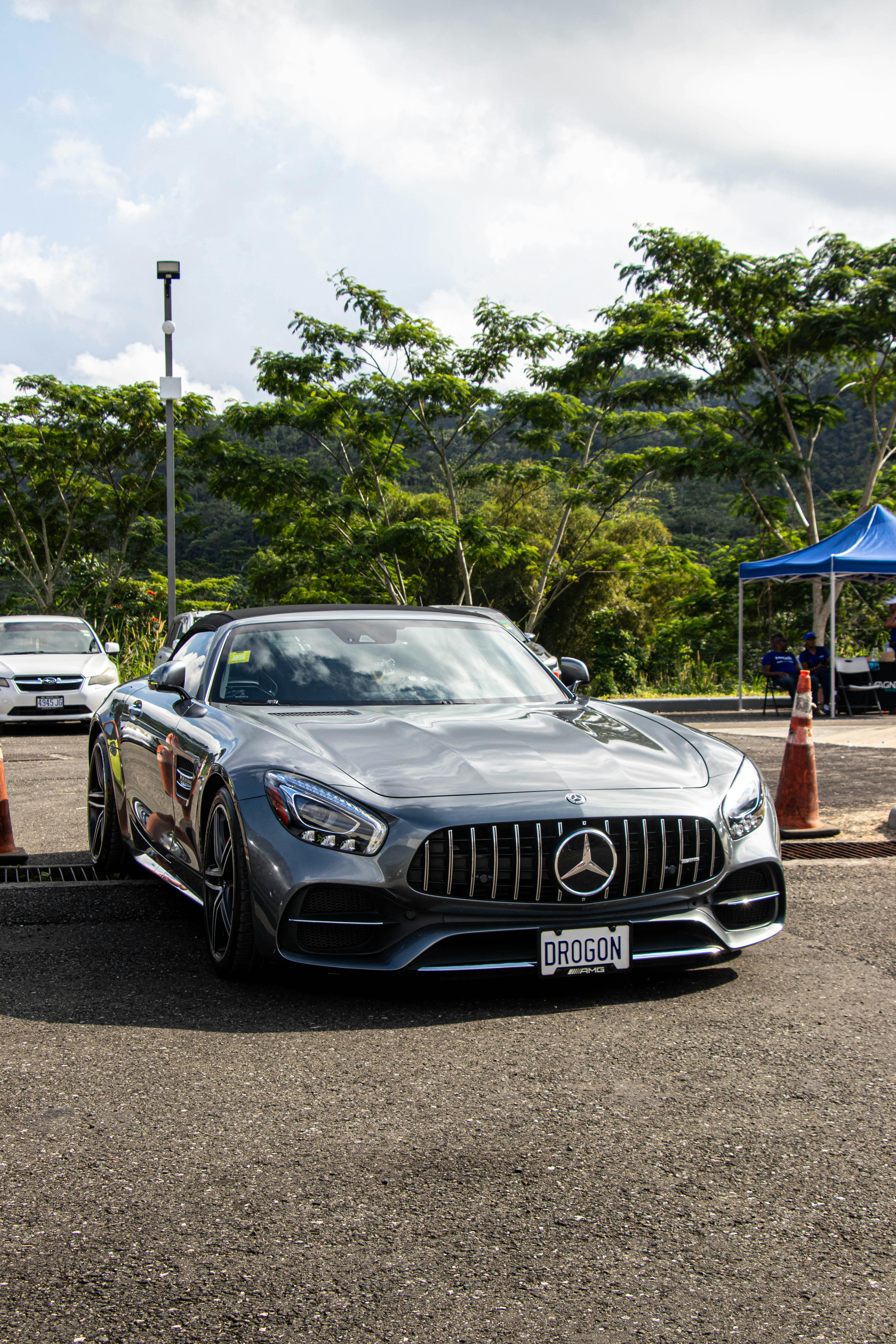Luxury Car Display in Scenic Outdoor Setting · Free Stock Photo