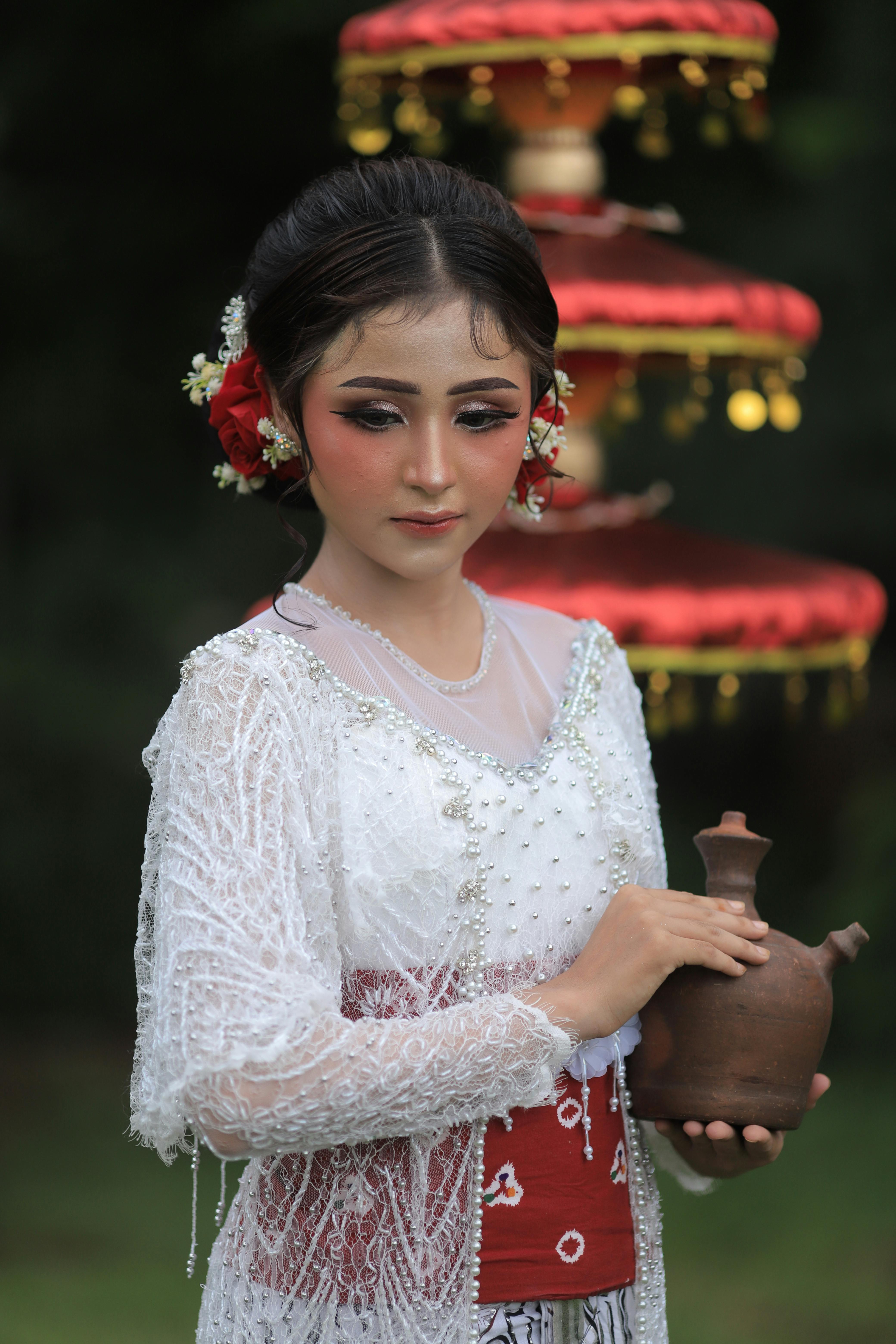 Traditional Asian Woman in Cultural Attire · Free Stock Photo