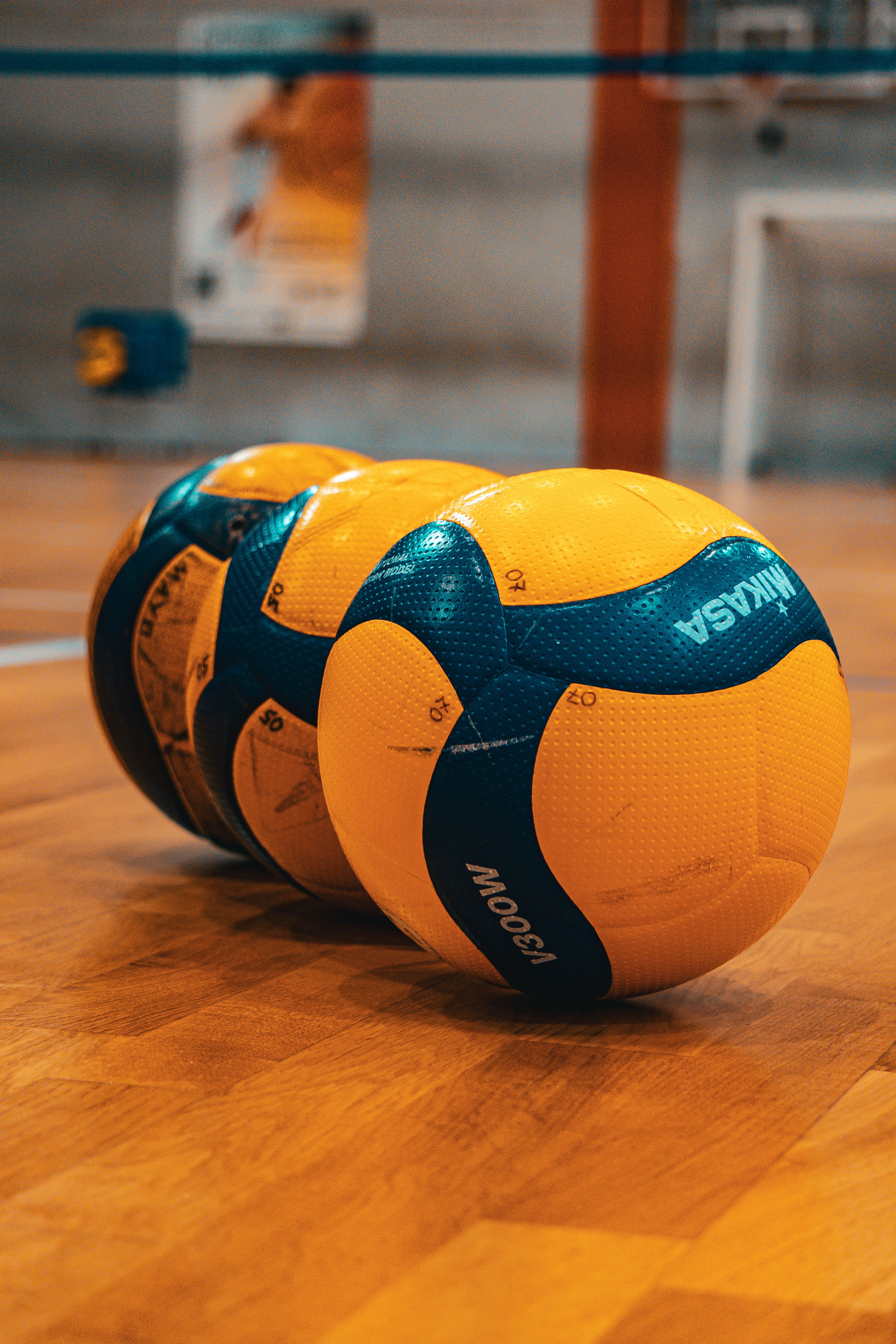 Three Volleyballs in Indoor Sports Court · Free Stock Photo