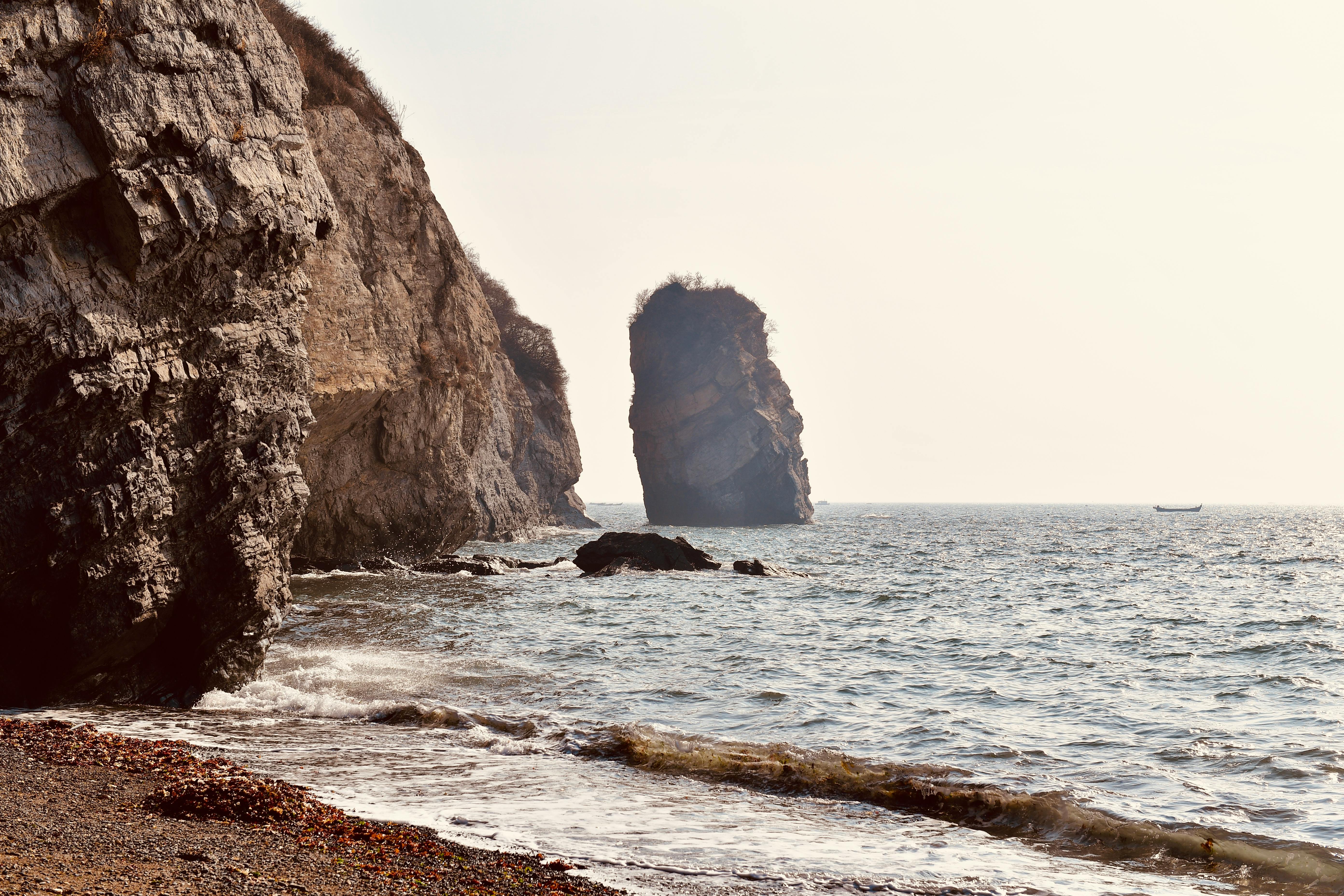 Scenic Coastal Landscape with Sea Stack and Cliffs · Free Stock Photo