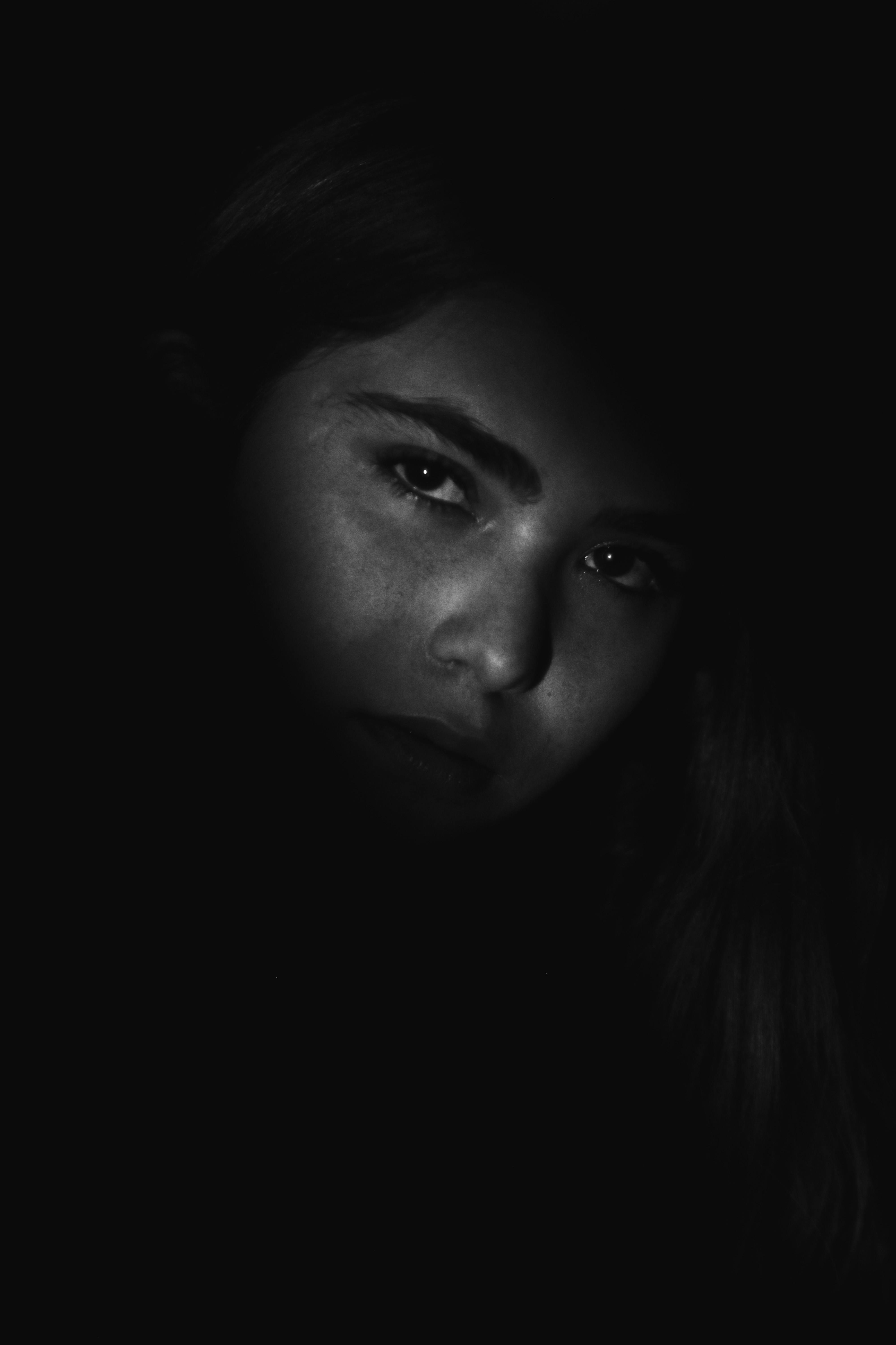 Dramatic Low Light Portrait of a Young Woman · Free Stock Photo
