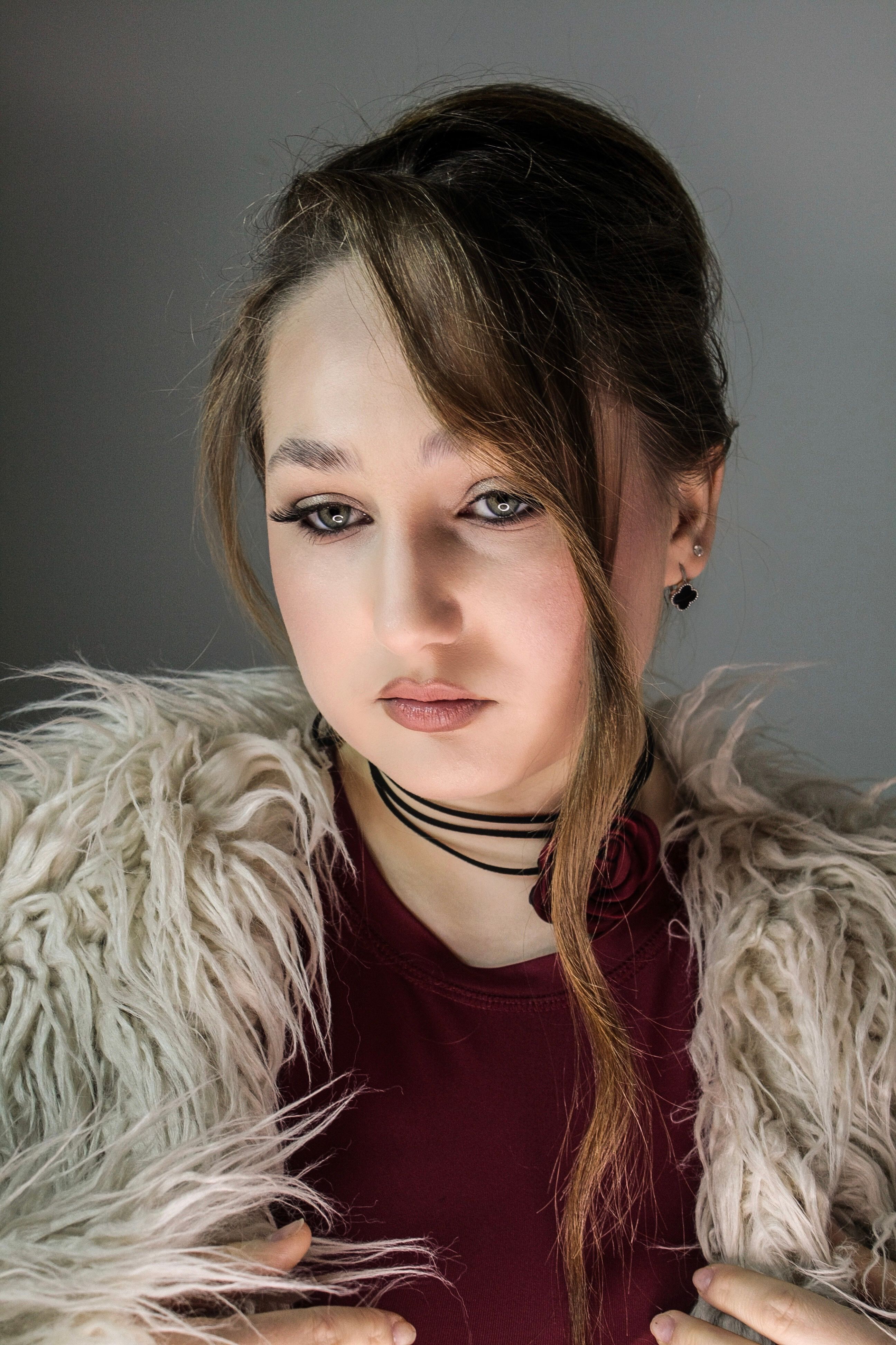 Thoughtful Woman in Stylish Fur Jacket Portrait · Free Stock Photo