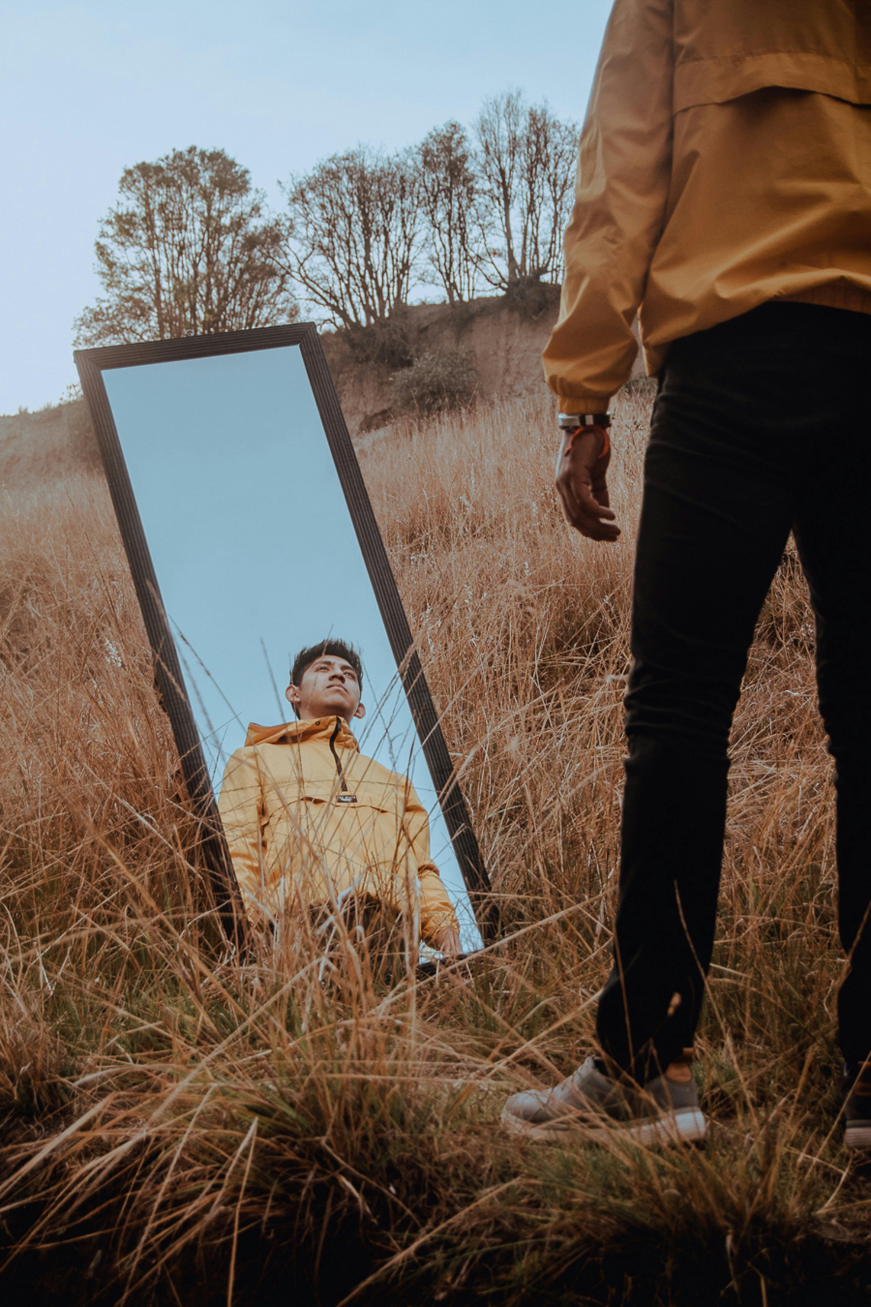 Reflective Portrait in Natural Landscape · Free Stock Photo