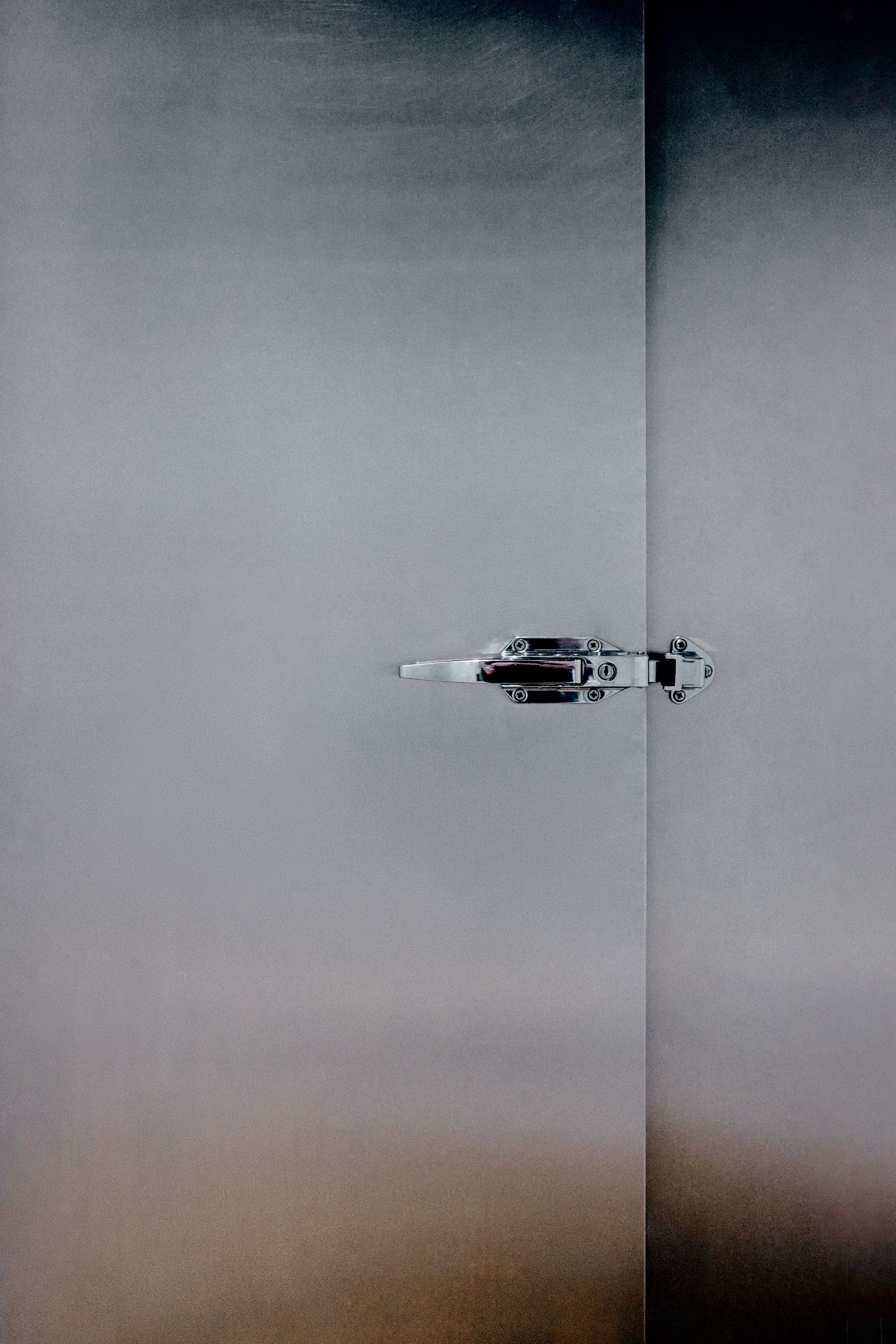 Minimalist Close-up of Metallic Door Lock · Free Stock Photo