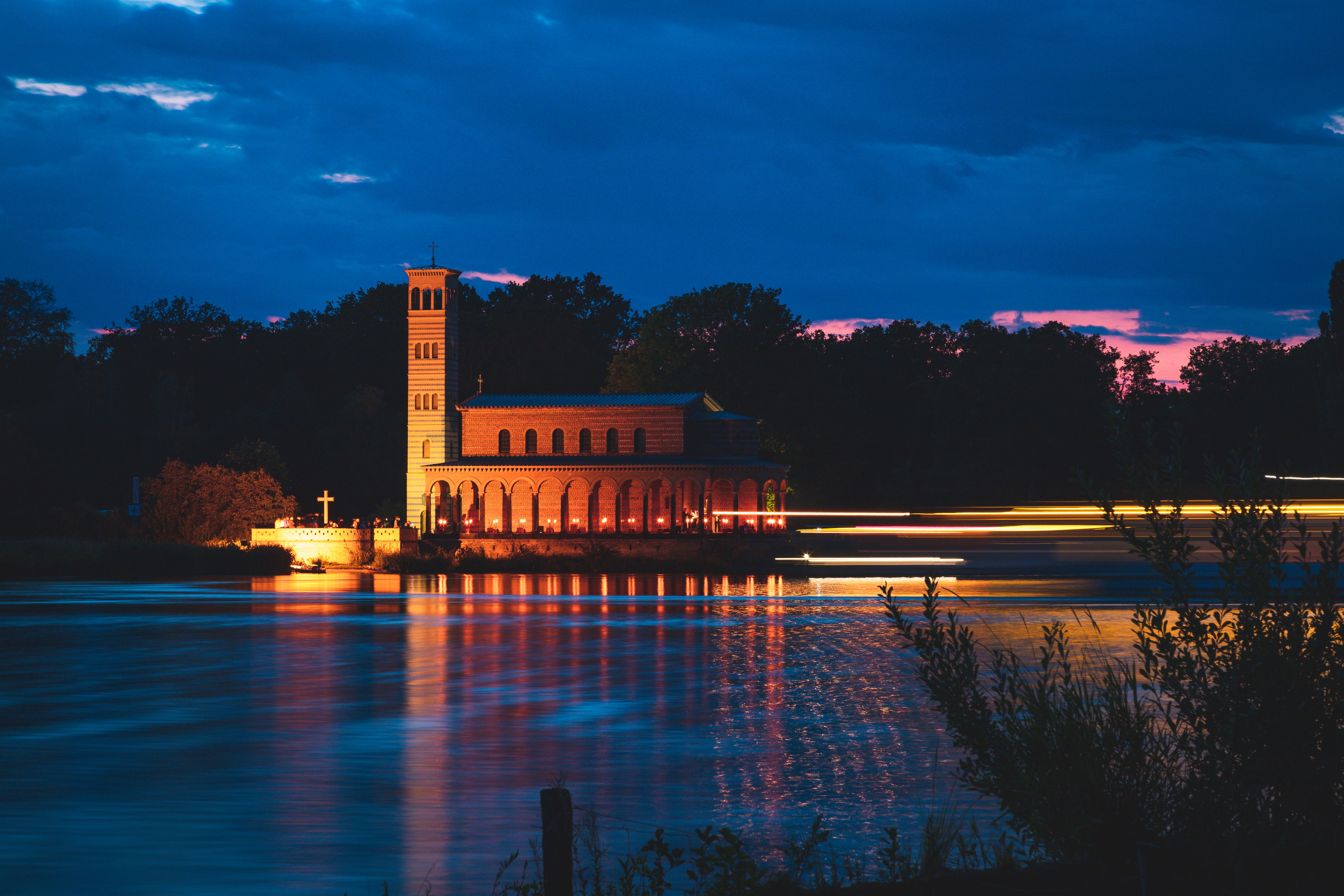 Stunning Evening View of Historic Church by the Lake · Free Stock Photo