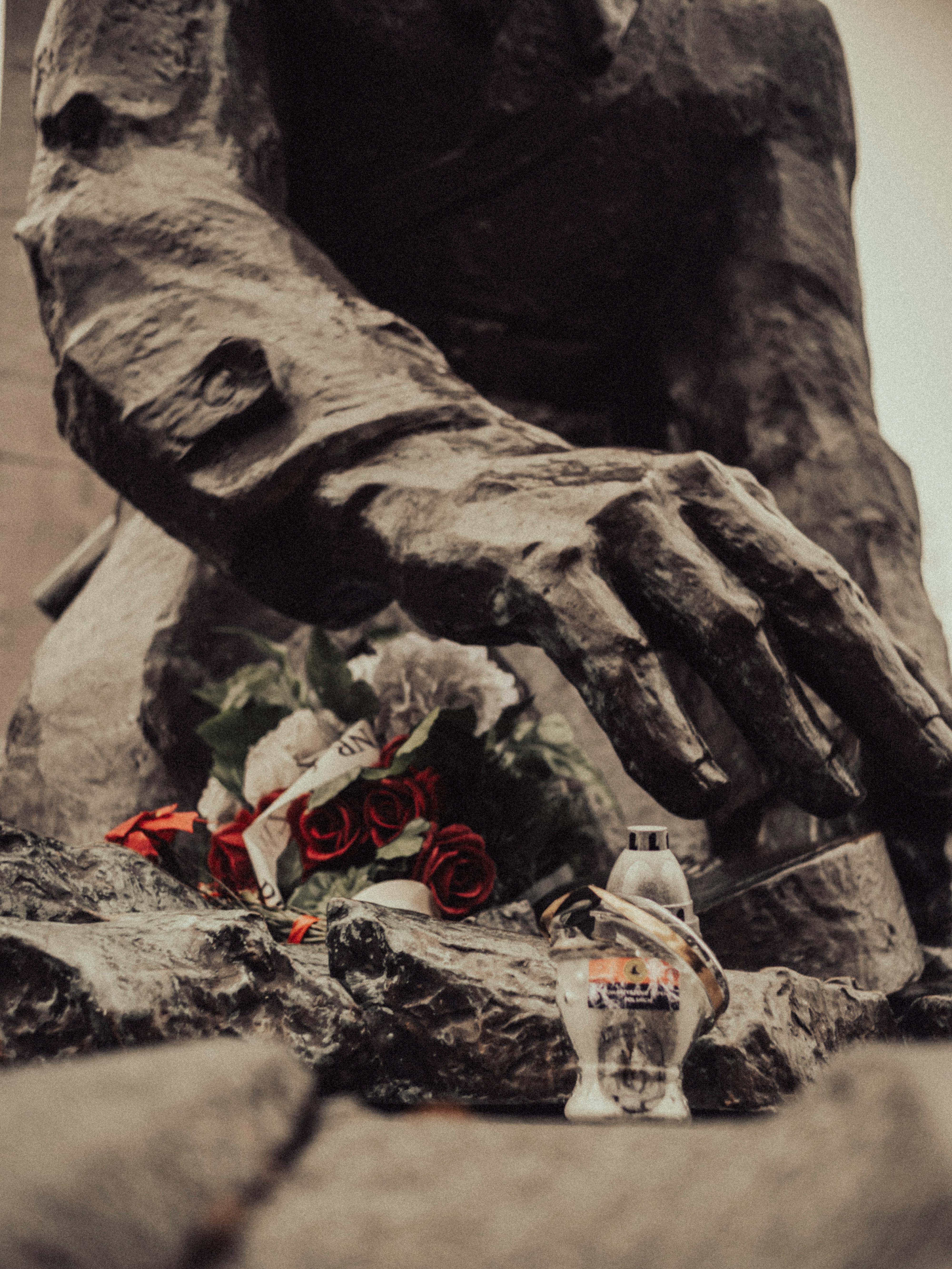 Close-up of Monument with Red Roses and Candle · Free Stock Photo