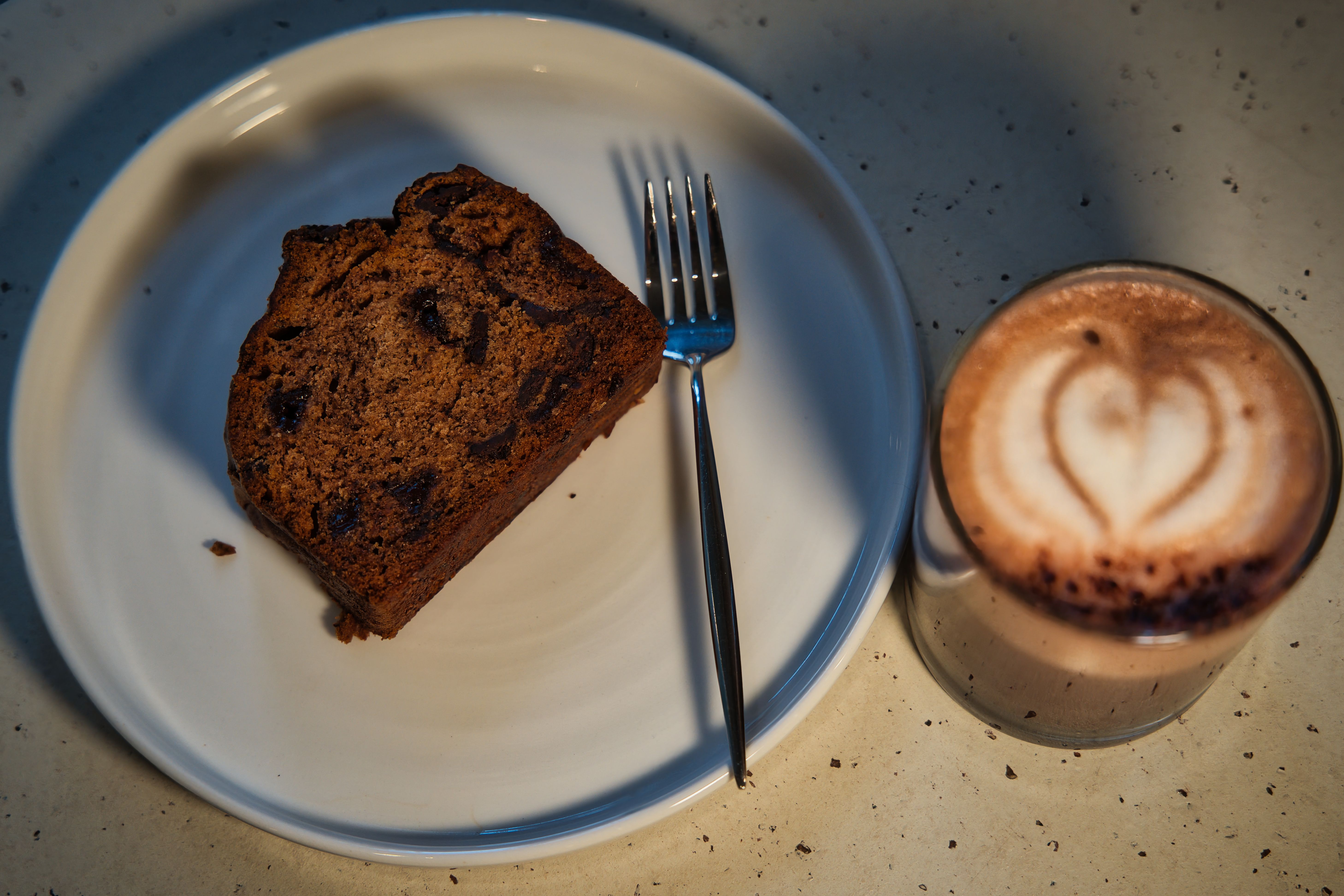 Cozy Coffee Break with Mocha and Cake Slice · Free Stock Photo