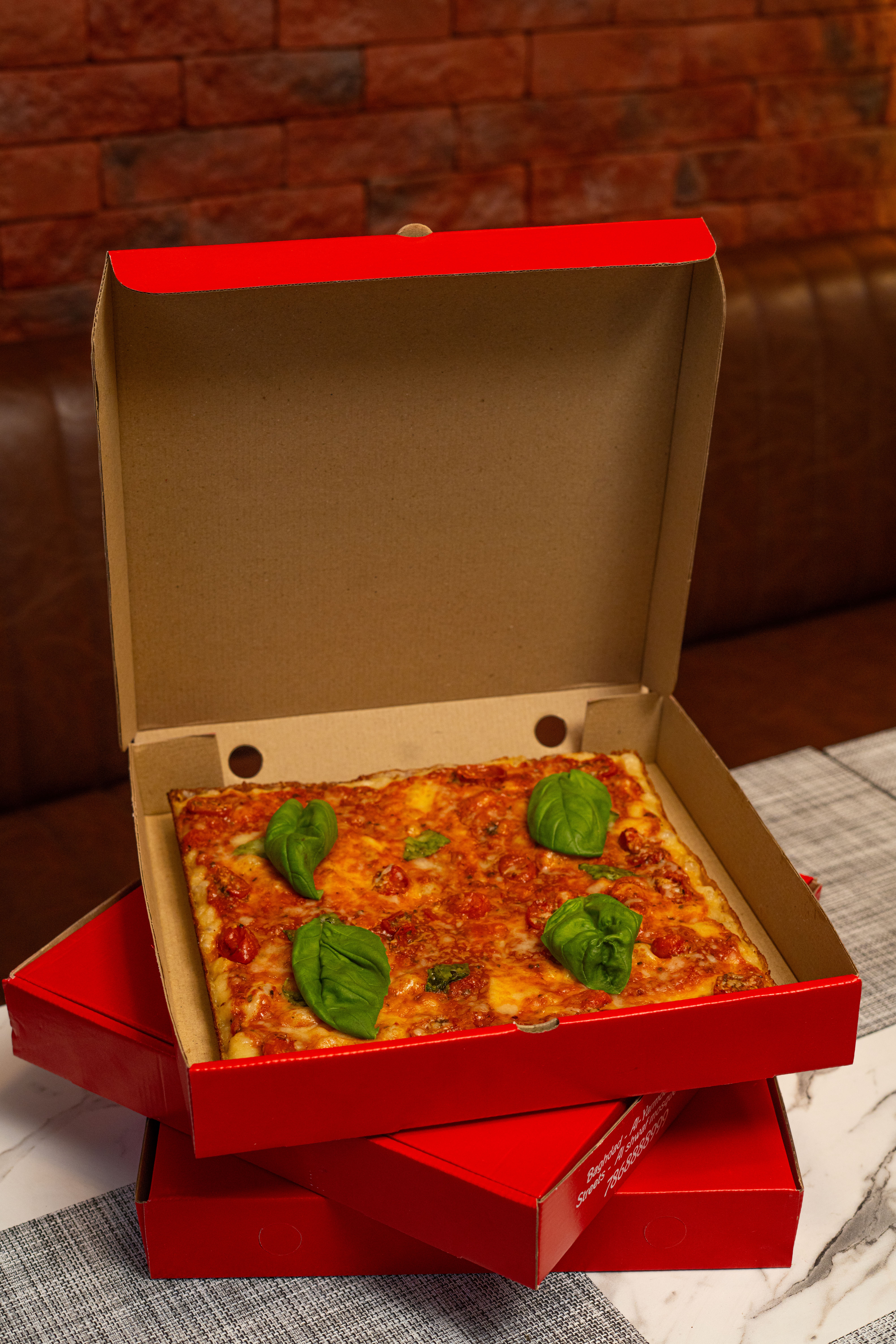 Delicious Pizza in Red Box with Basil Leaves · Free Stock Photo