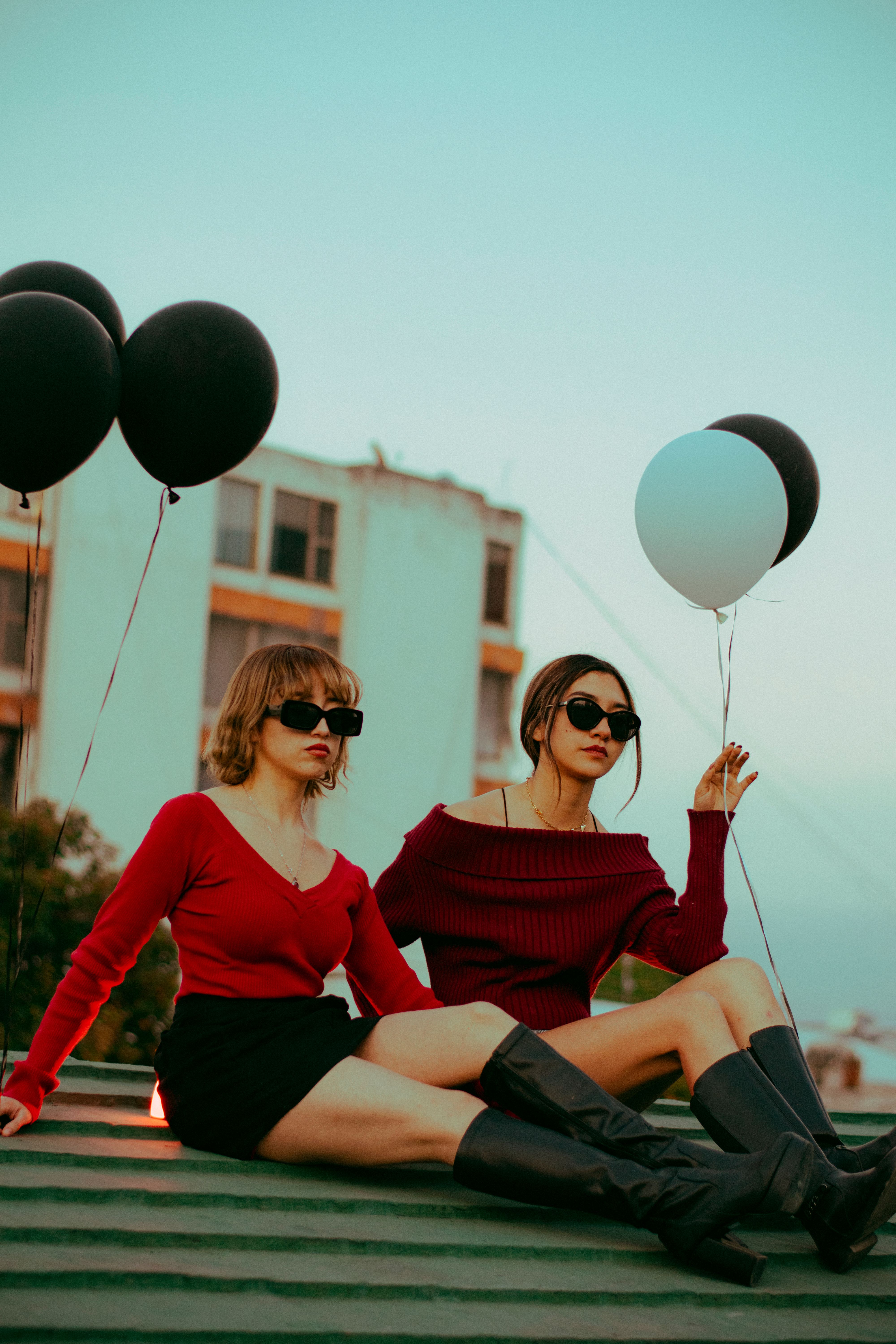 Stylish Women with Balloons in Urban Setting · Free Stock Photo