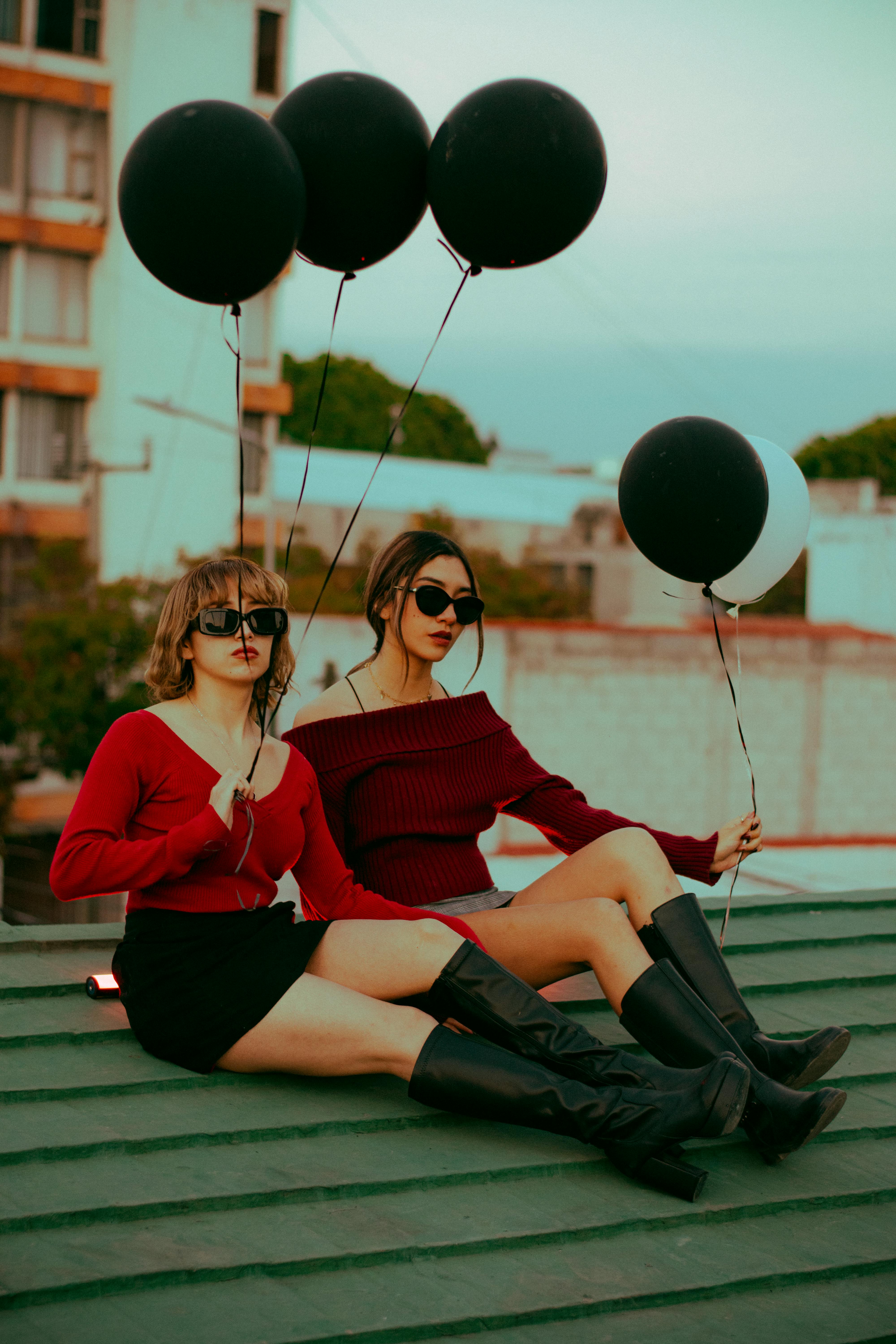 Fashionable Women with Balloons on Rooftop · Free Stock Photo