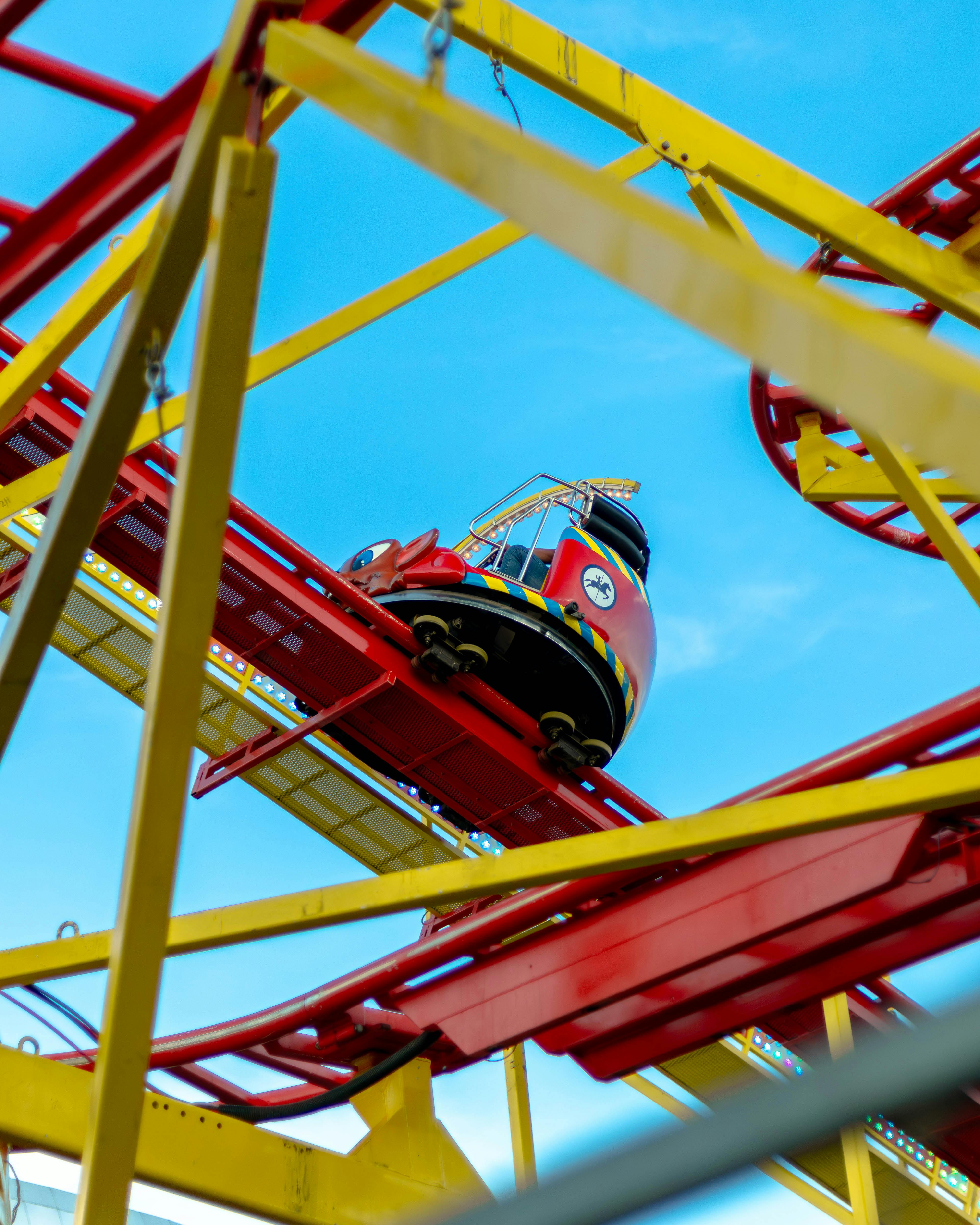 Colorful Roller Coaster Ride at Theme Park · Free Stock Photo