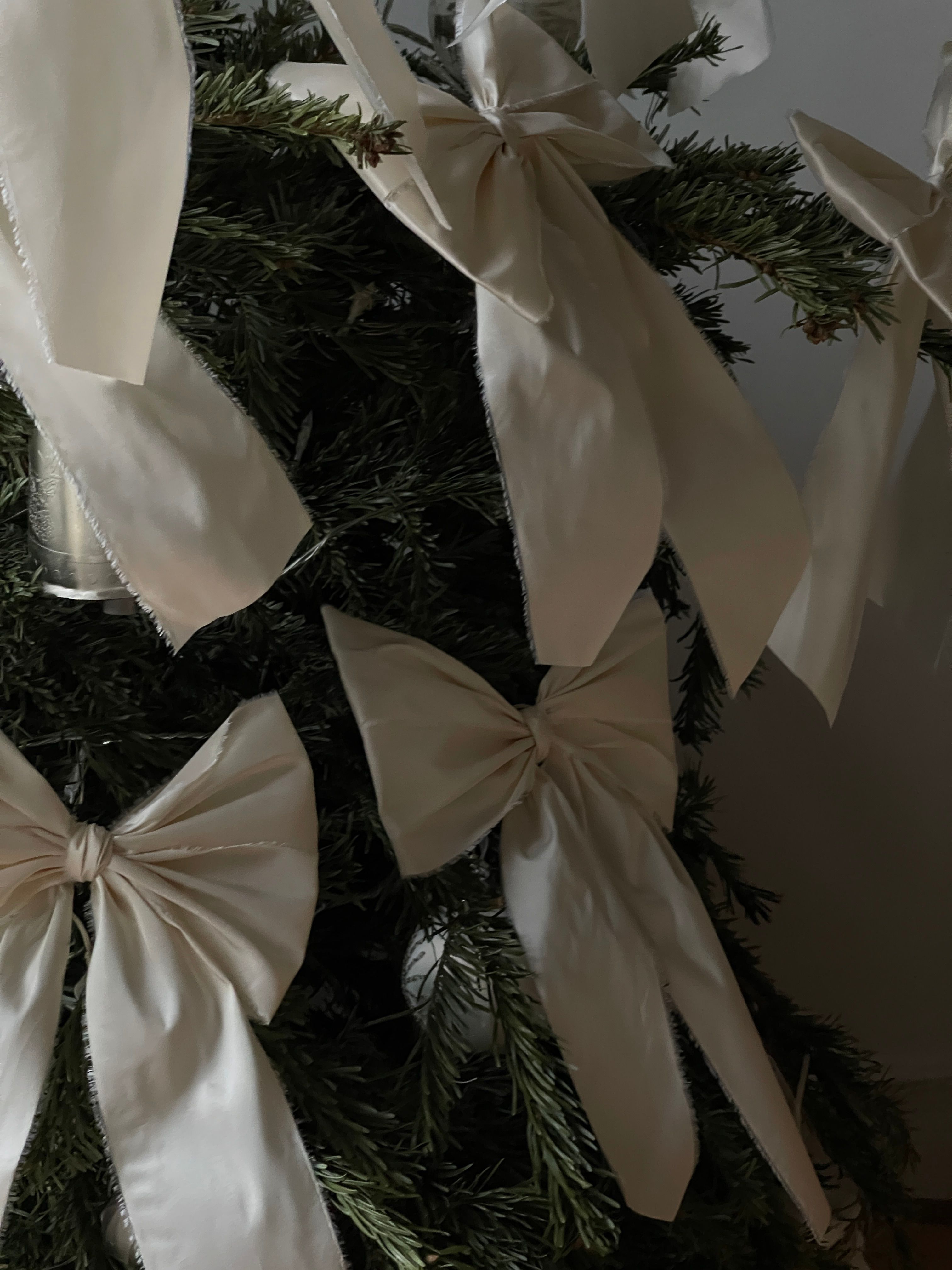 Festive Christmas Tree with Elegant White Bows · Free Stock Photo