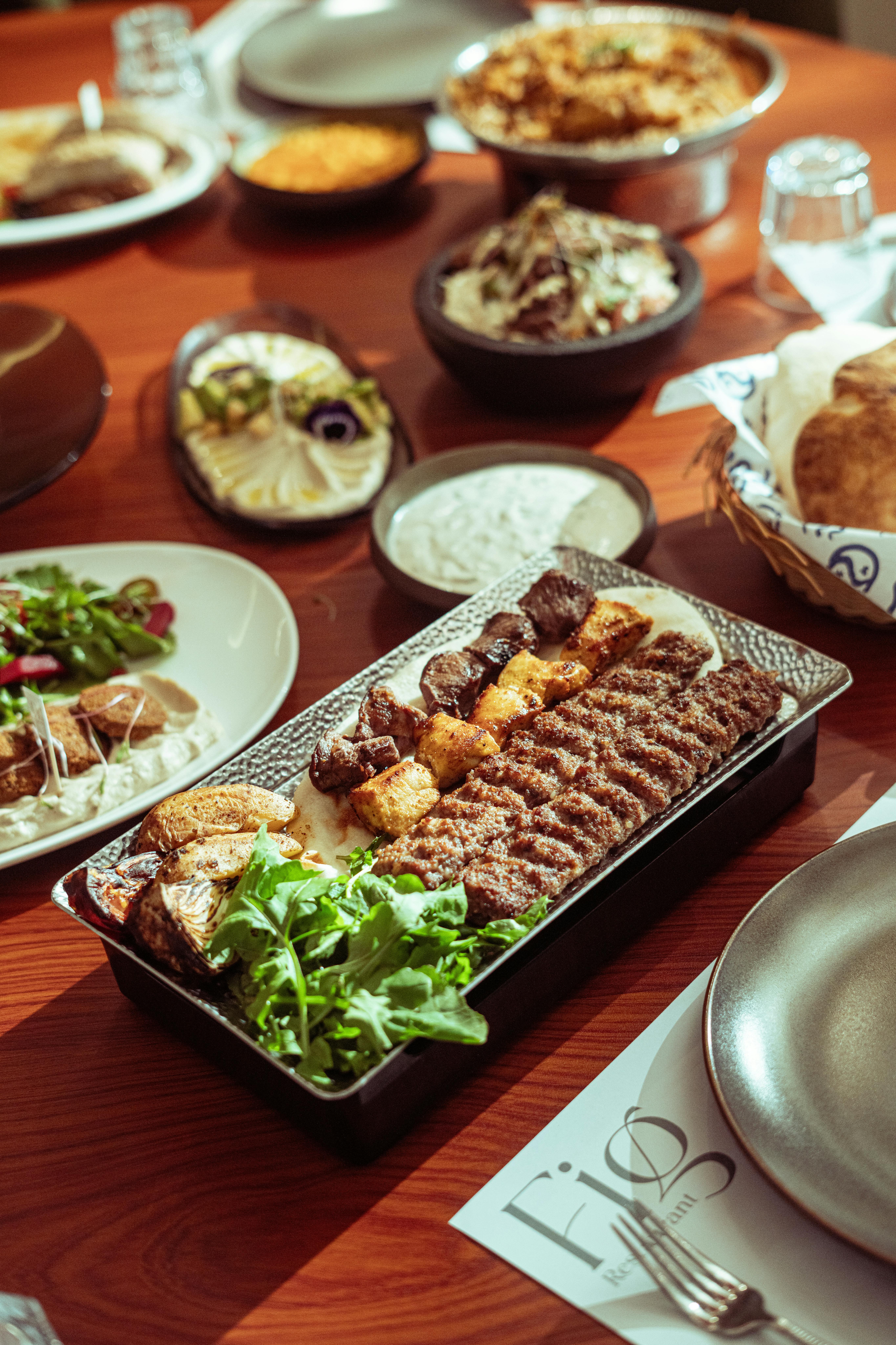 Traditional Middle Eastern Feast with Kebabs · Free Stock Photo