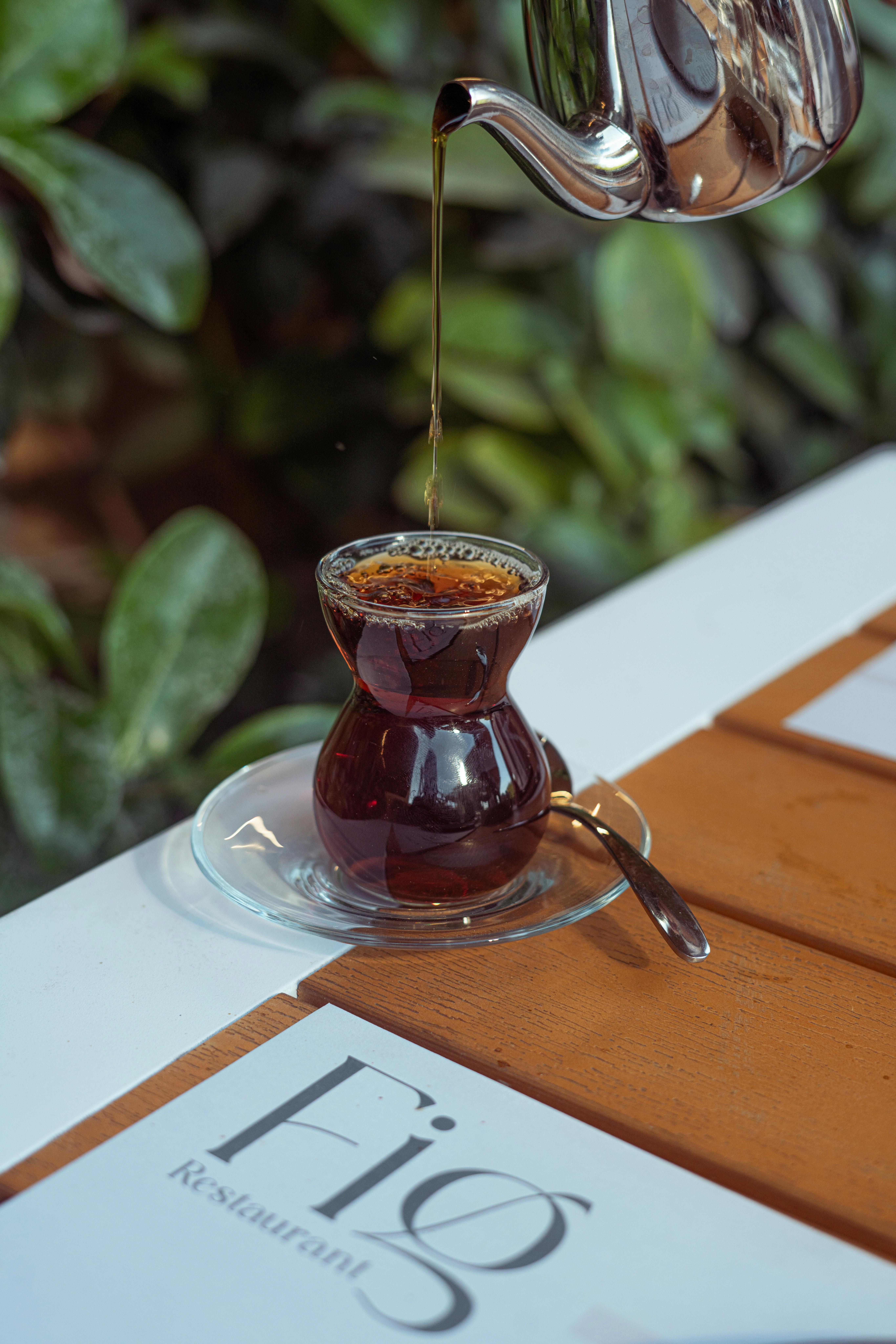 Traditional Iraqi Tea Pouring Ceremony Outdoors · Free Stock Photo