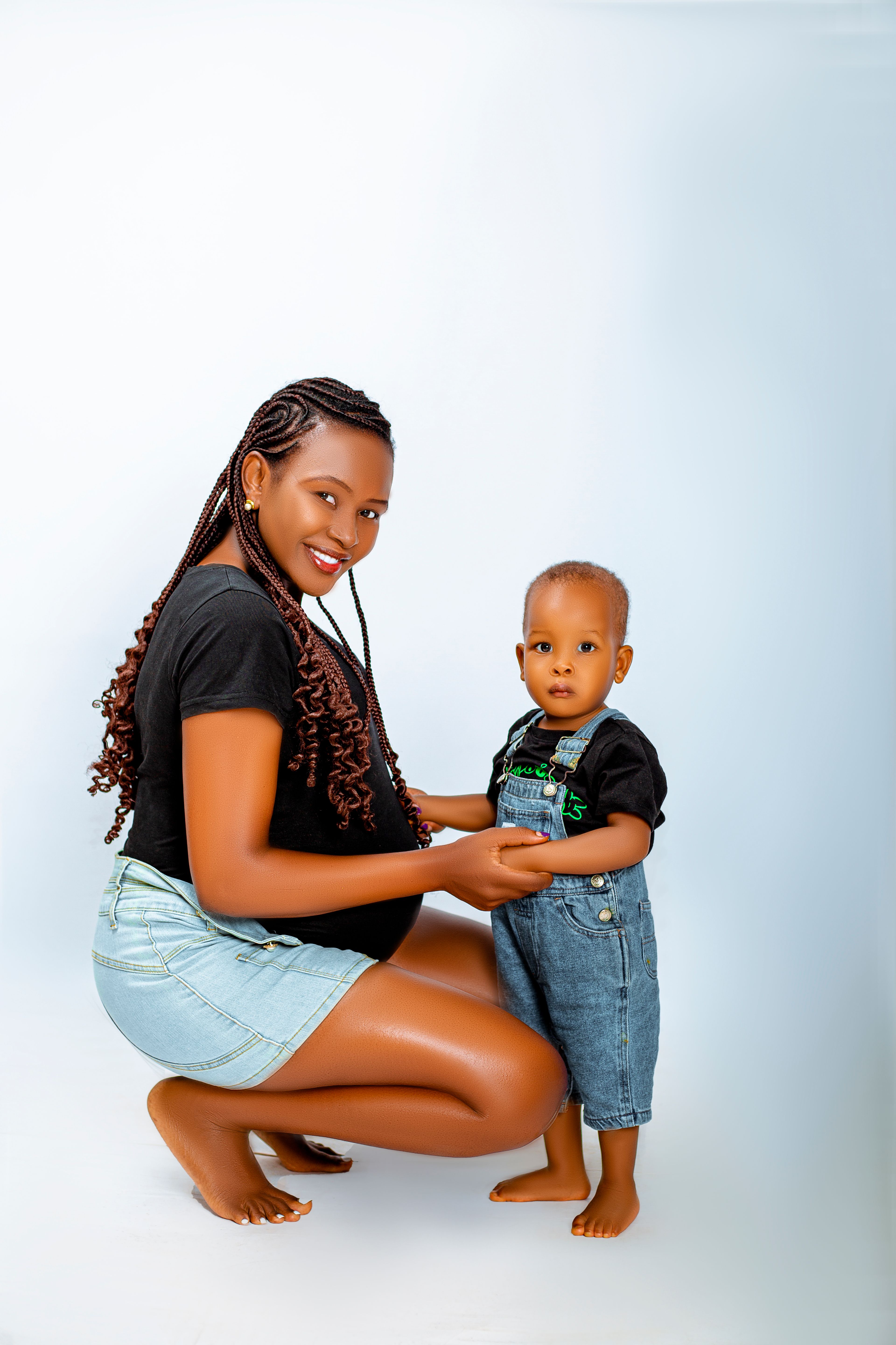 Mother and Child Portrait in Studio Setting · Free Stock Photo