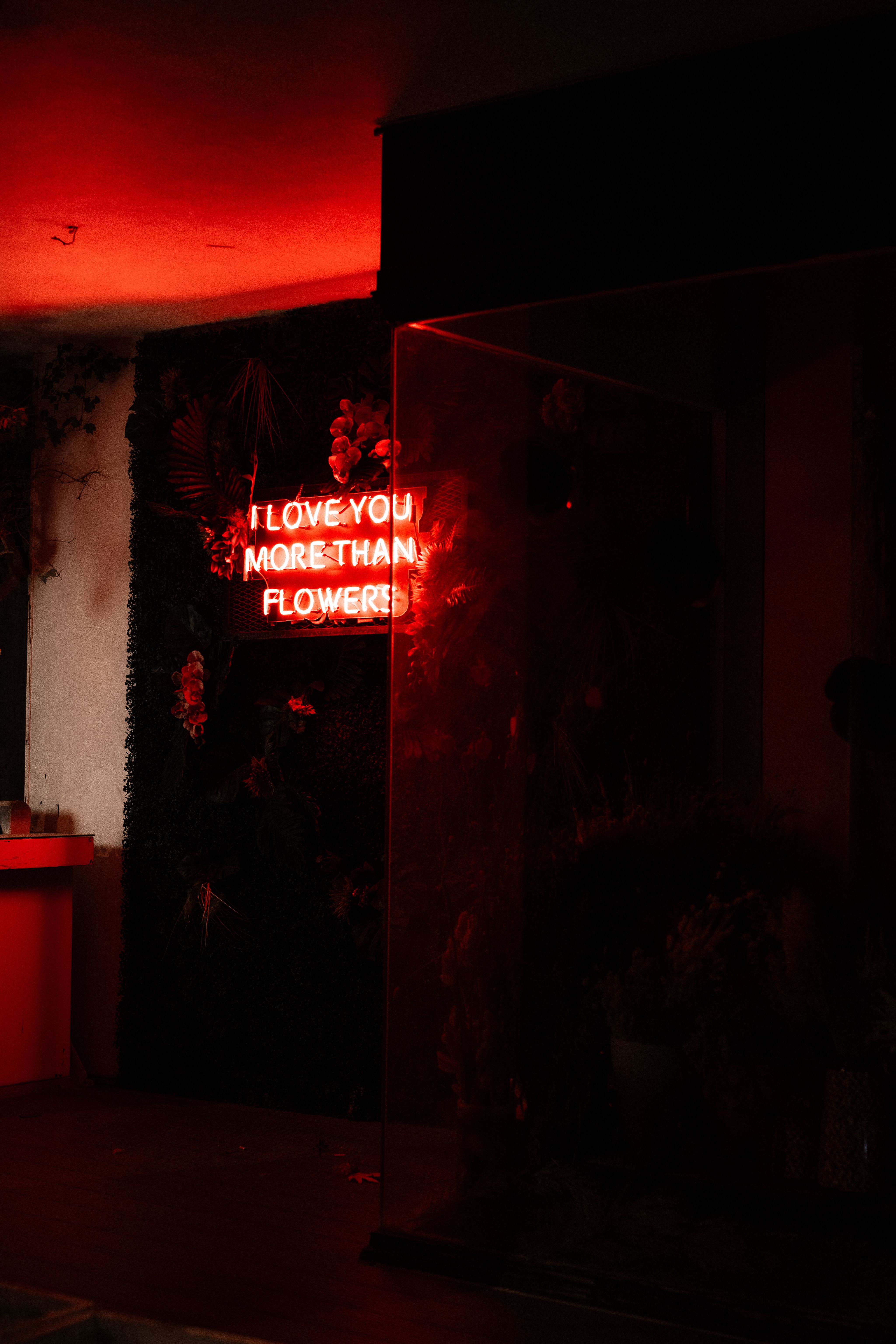 Romantic Neon Sign with Red Glow in Dark Room · Free Stock Photo