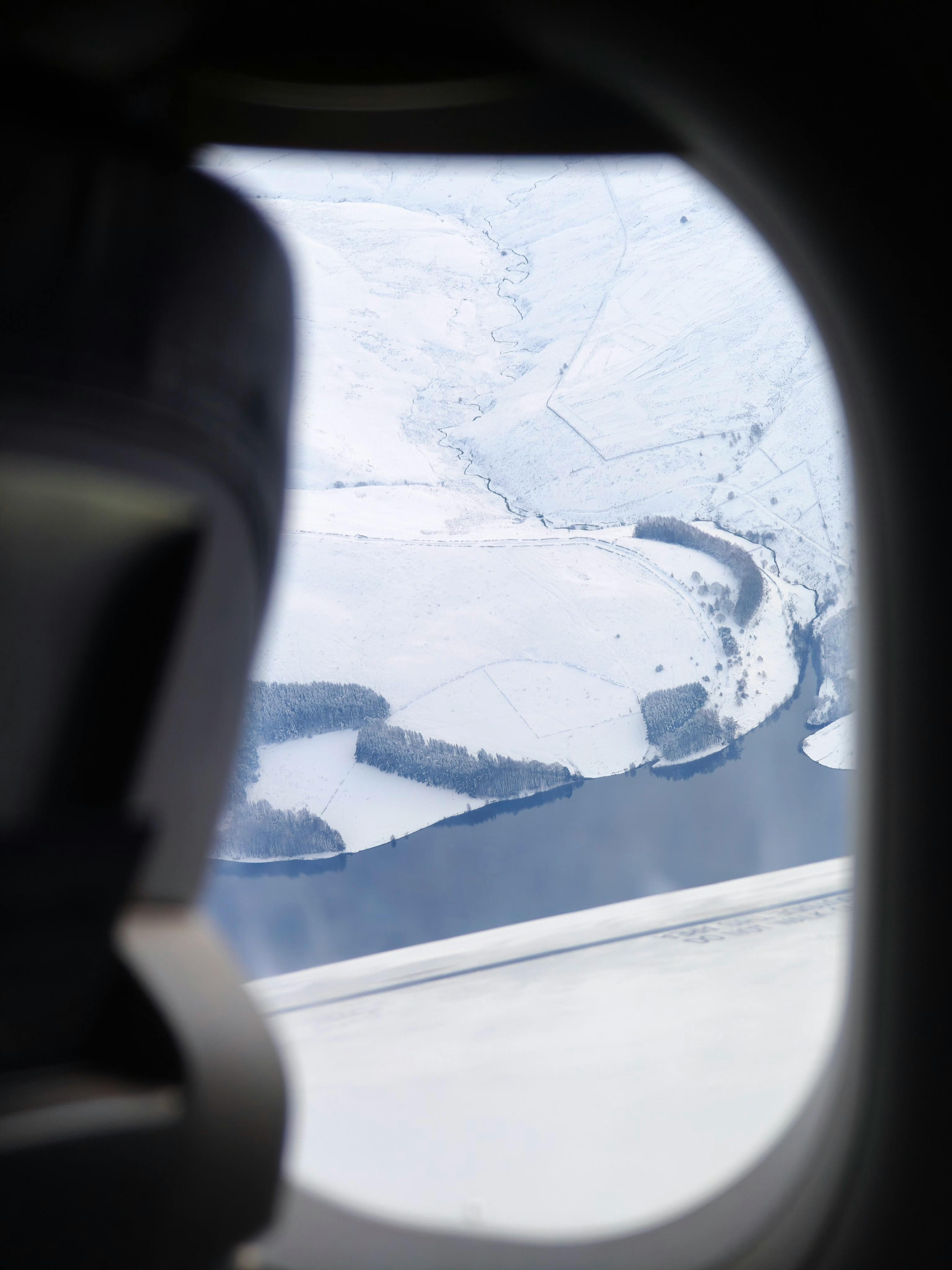 Aerial Winter Landscape View from Airplane Window · Free Stock Photo